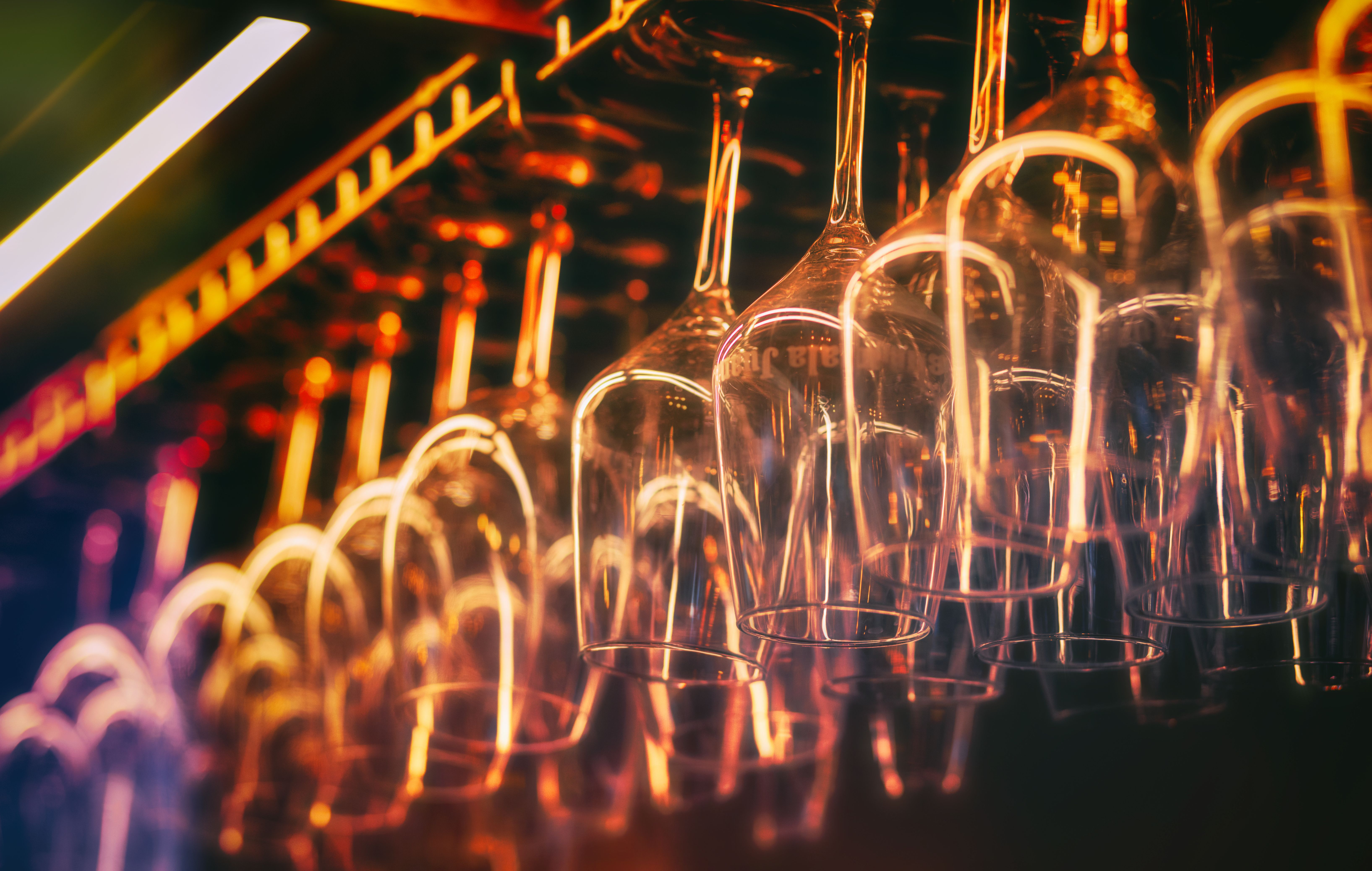 Elegant Wine Glasses in Warm Lighting Display · Free Stock Photo