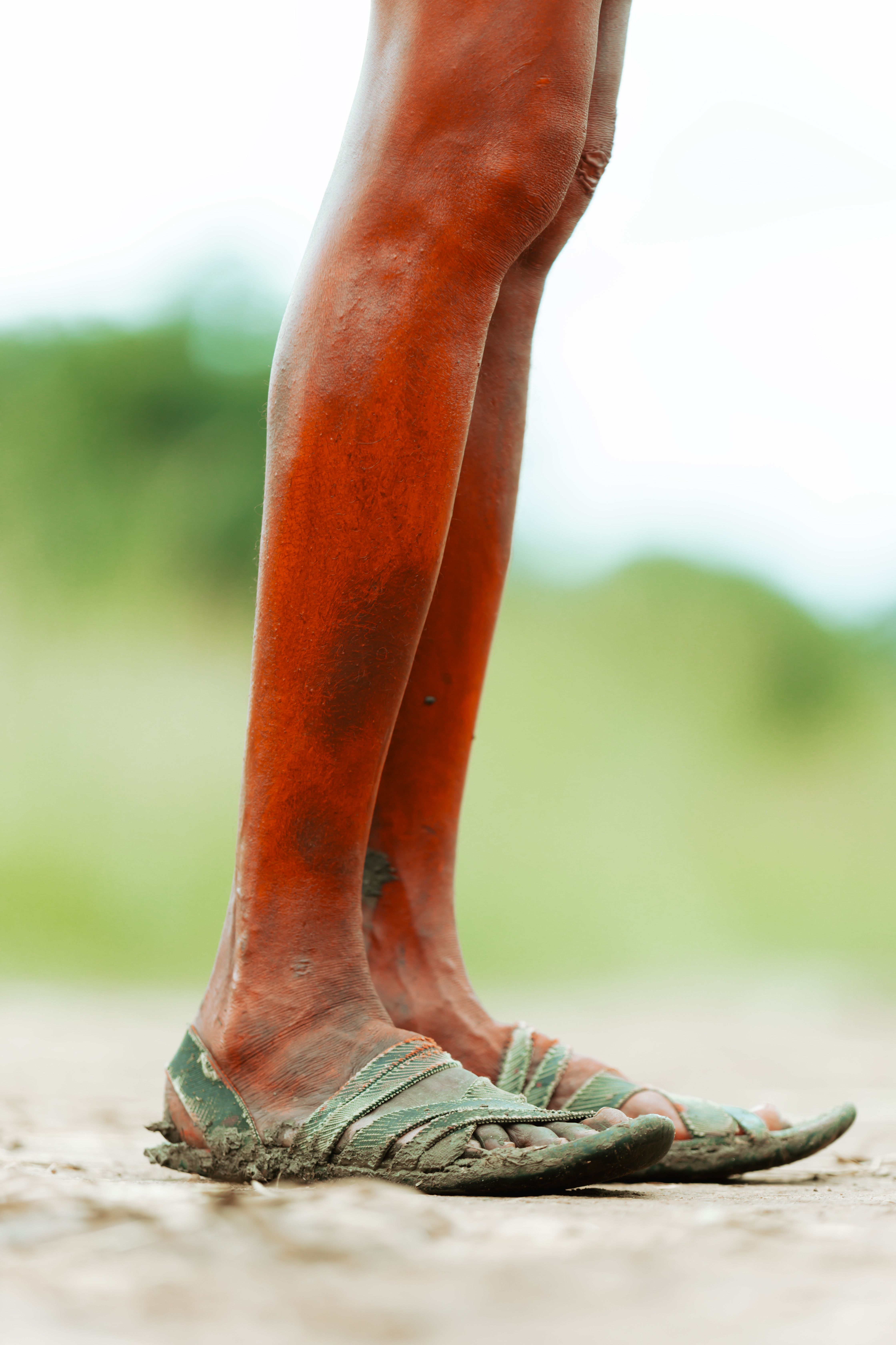 Traditional Sandals on Muddy Ground in Uganda · Free Stock Photo