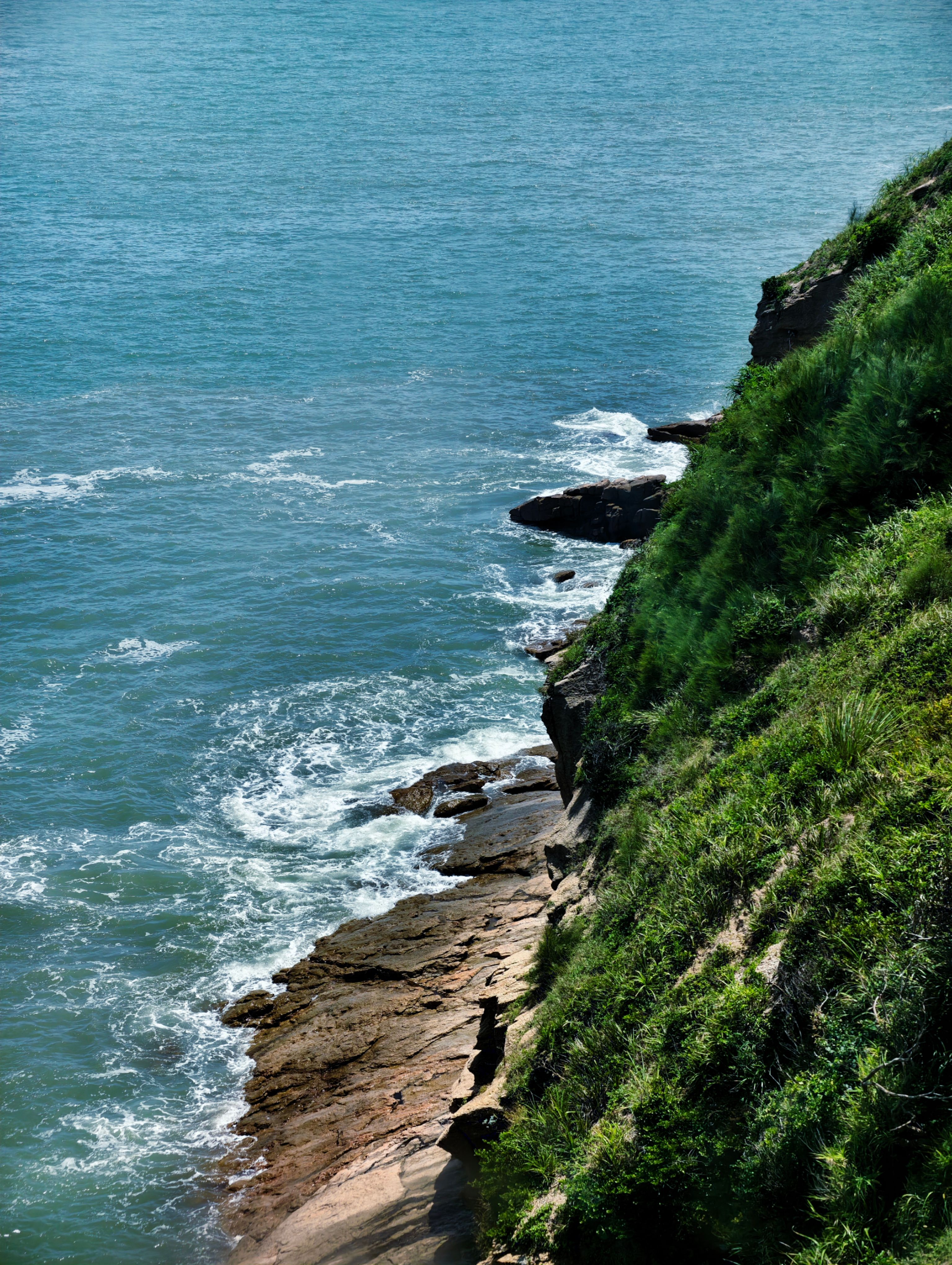 High Angle View of a Cliff and Sea · Free Stock Photo