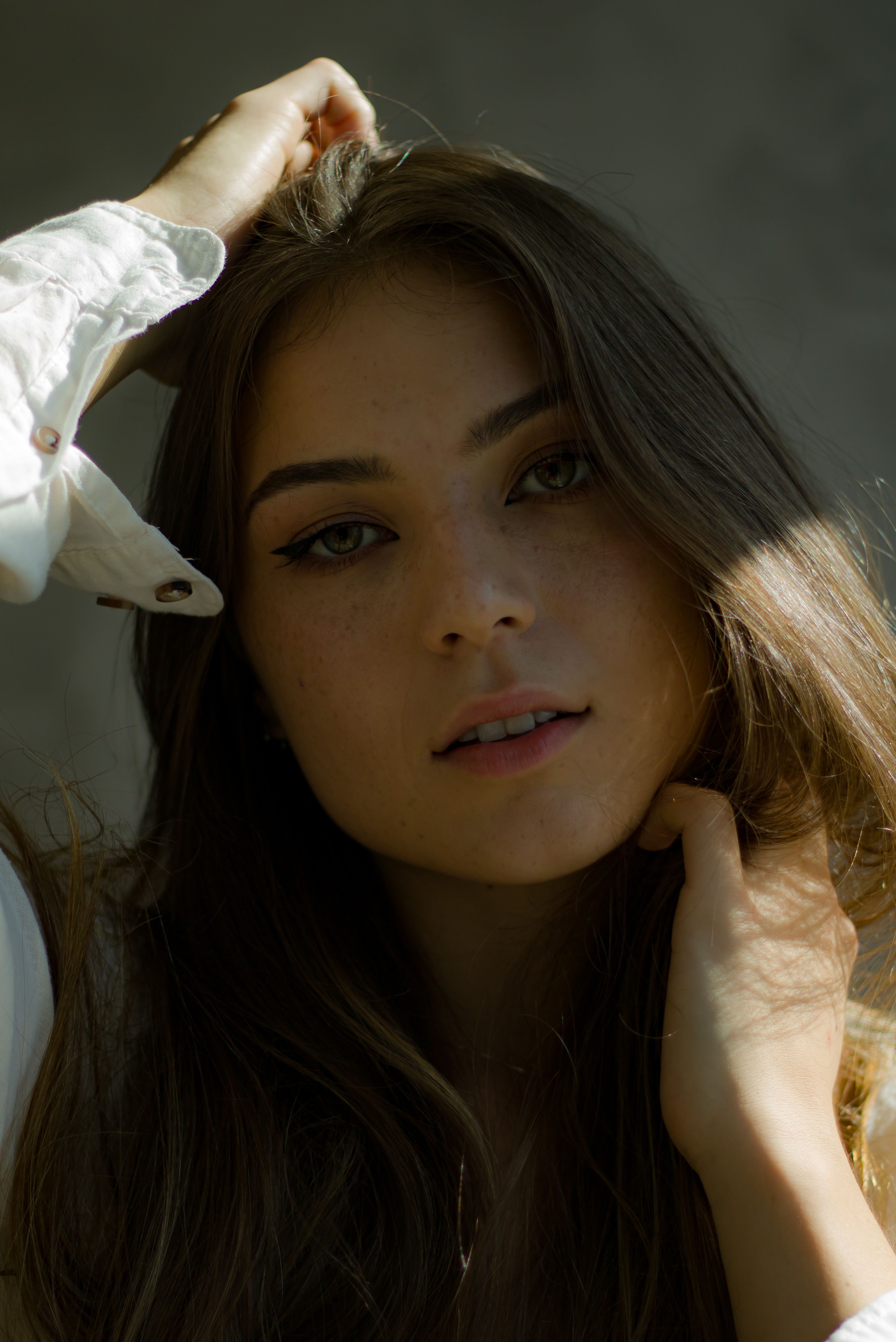 Portrait of a Woman with Soft Sunlight · Free Stock Photo