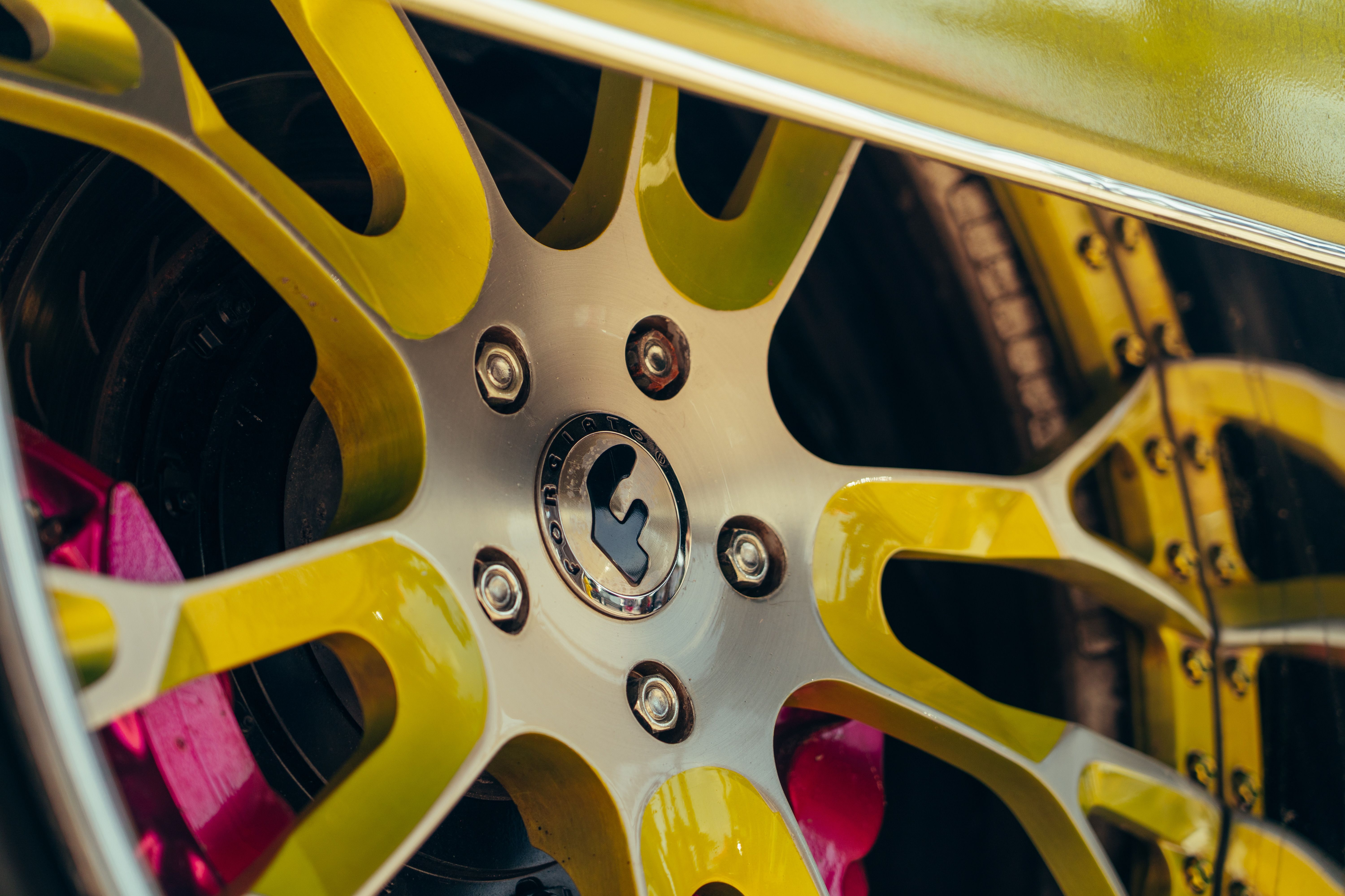 Close-up of Vibrant Custom Car Wheel Rim · Free Stock Photo