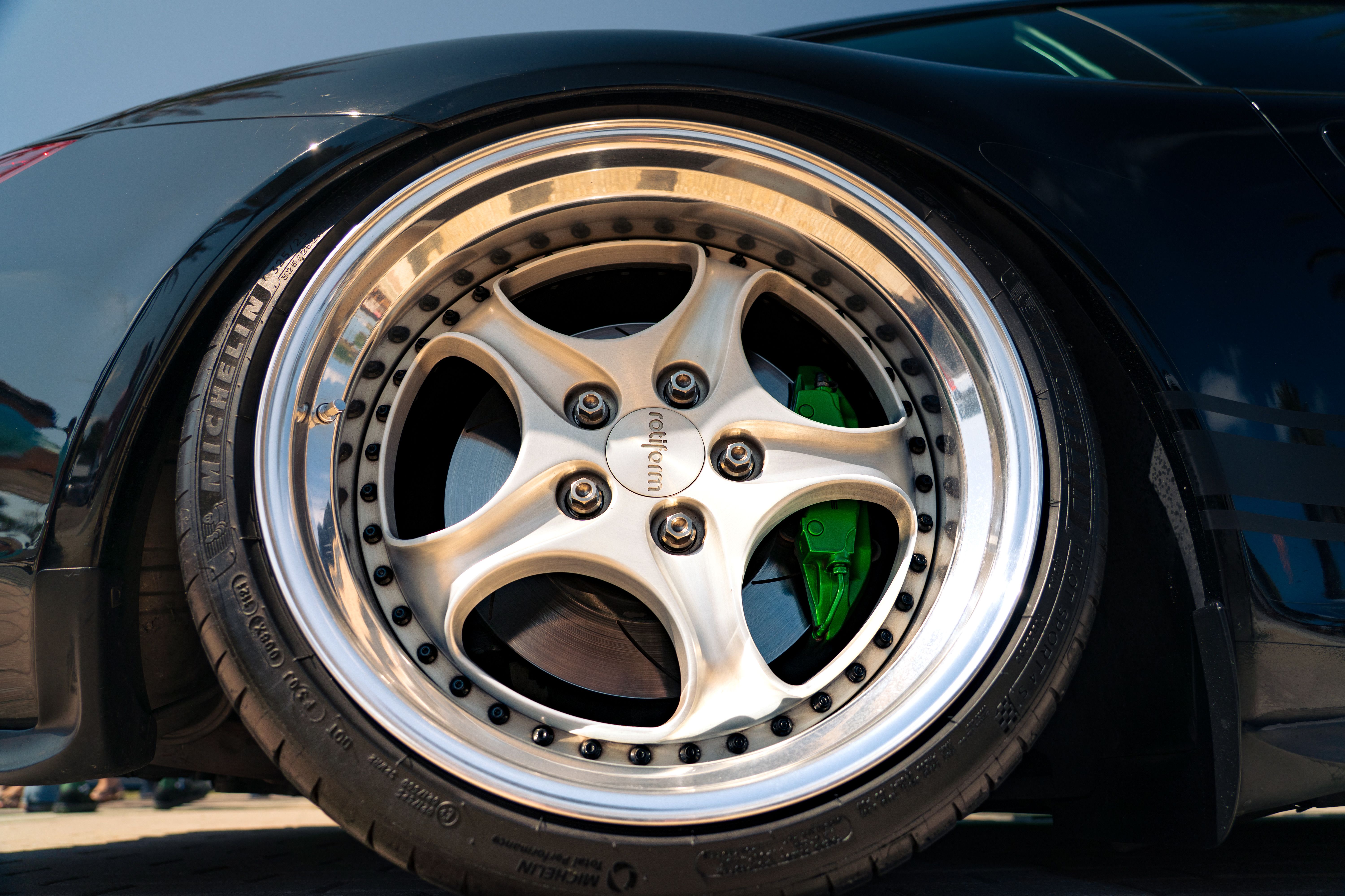 Close-up of Stylish Custom Car Wheel Rim · Free Stock Photo