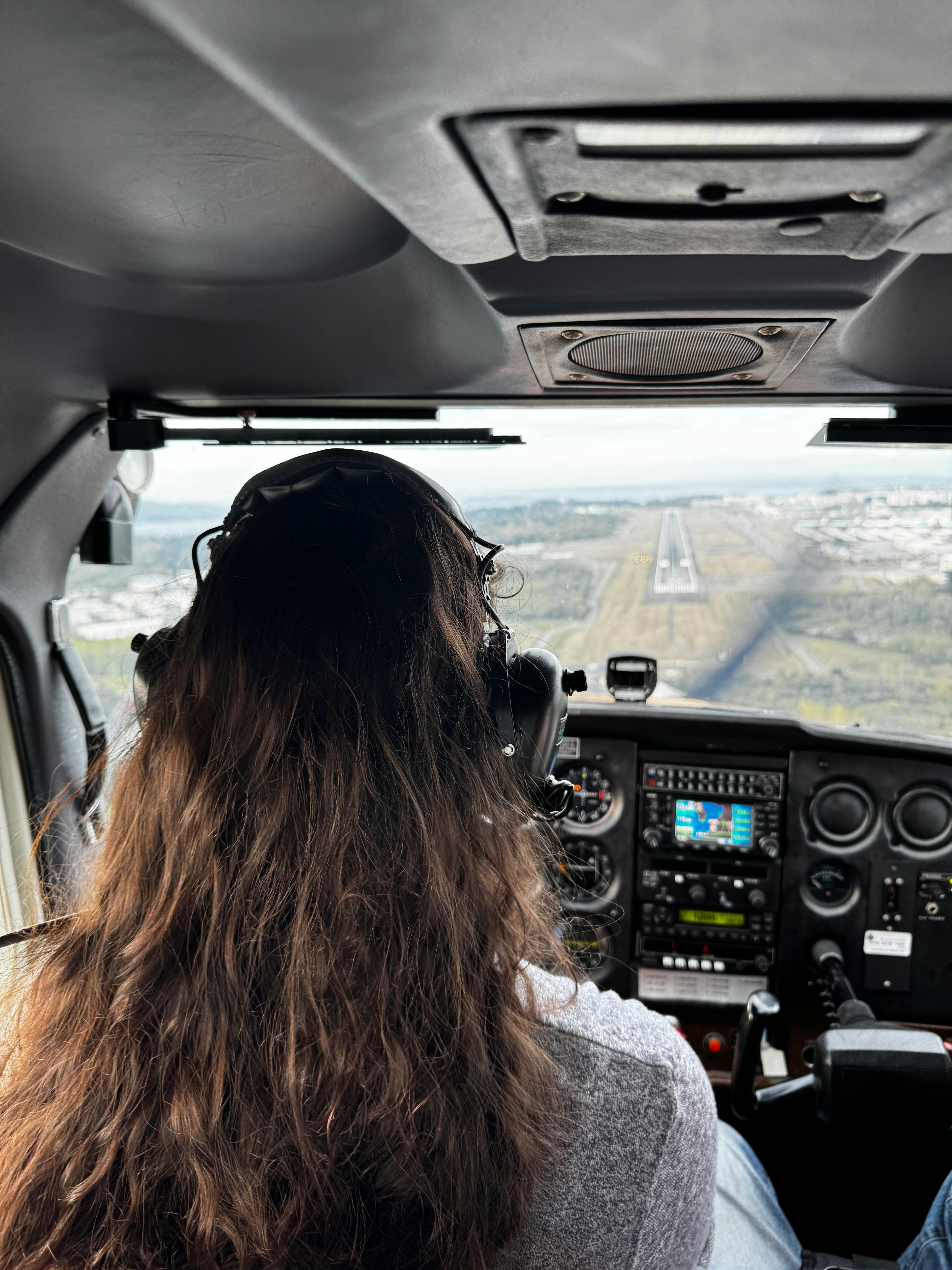 Female Pilot Approaching Runway in Airplane Cockpit · Free Stock Photo