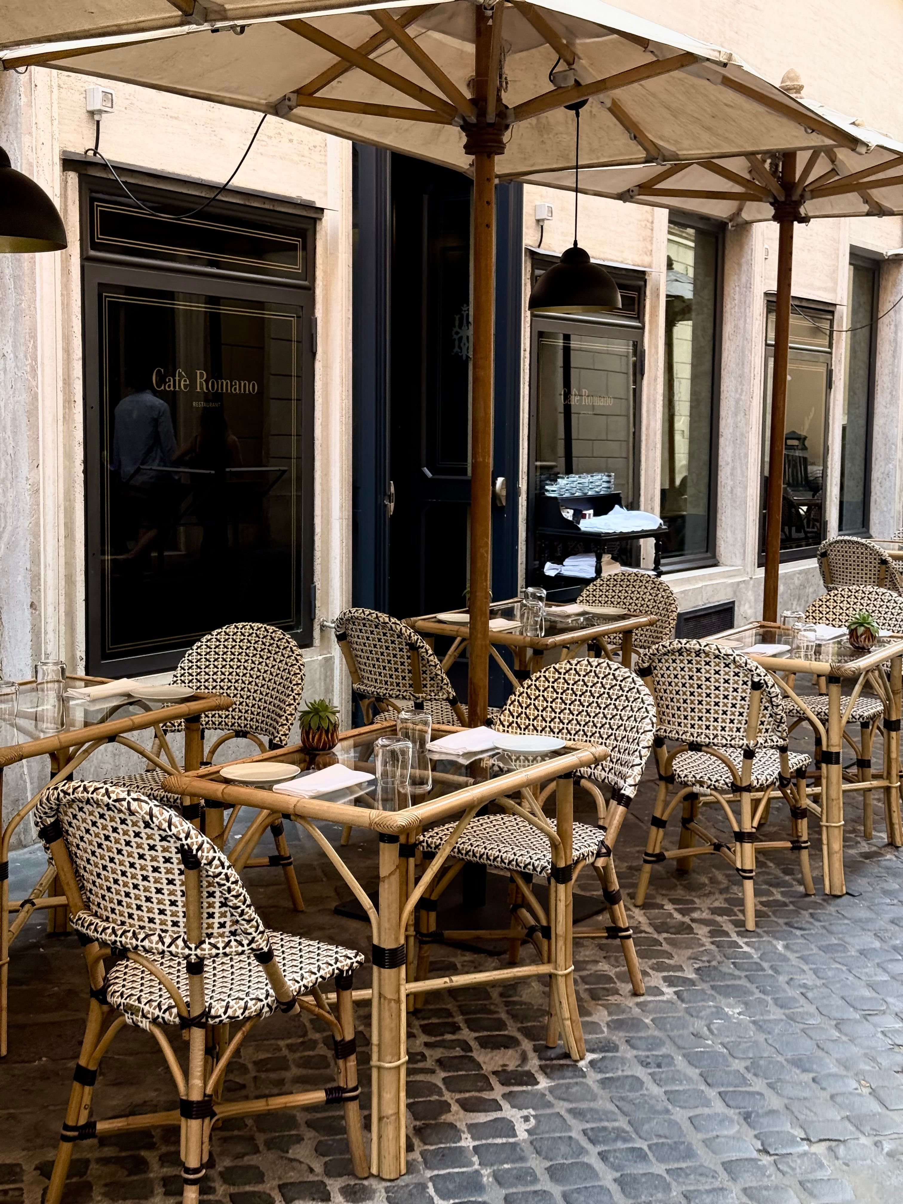 Charming Outdoor European Cafe on Cobbled Street · Free Stock Photo