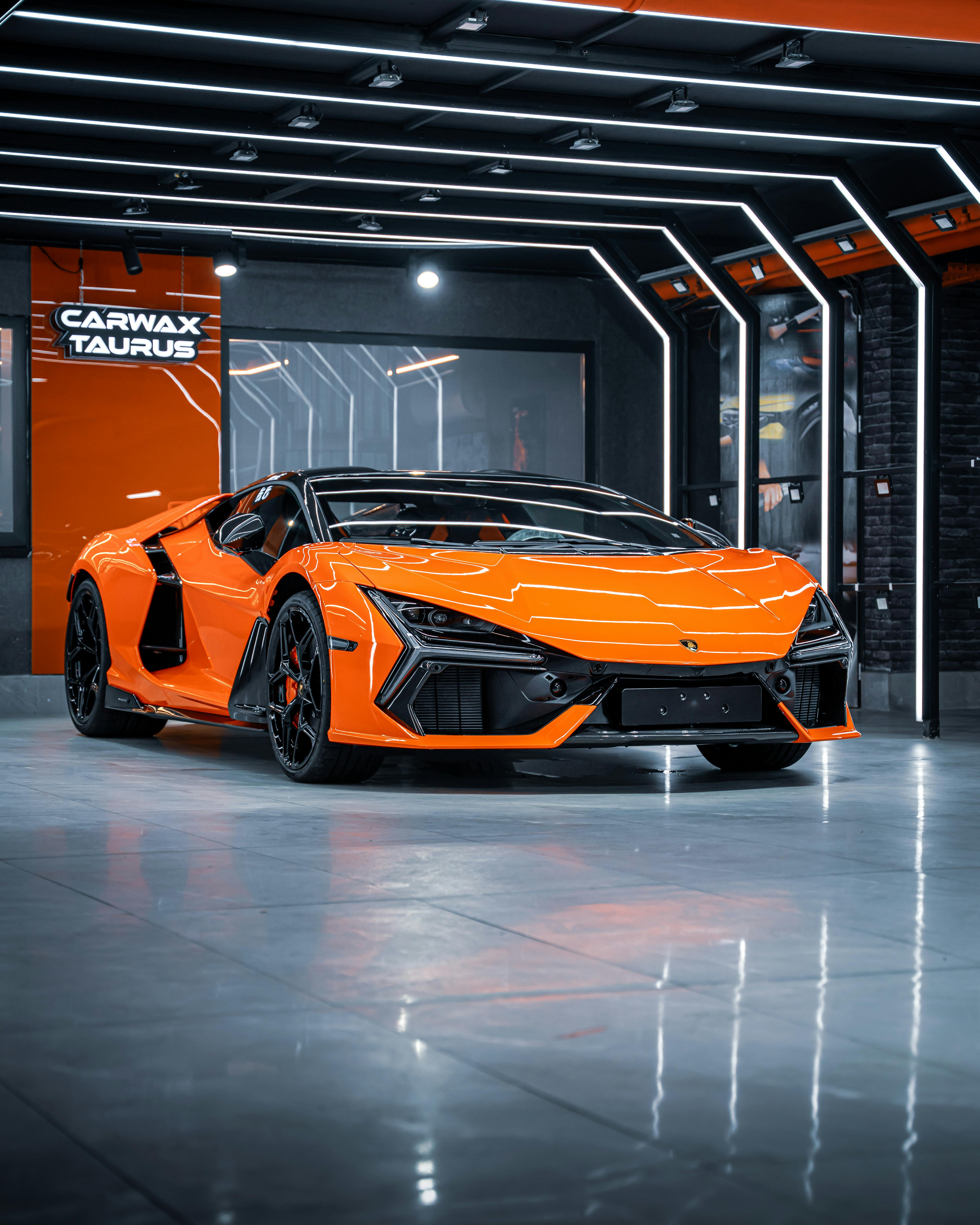 Stunning Orange Sports Car in Ankara Showroom · Free Stock Photo