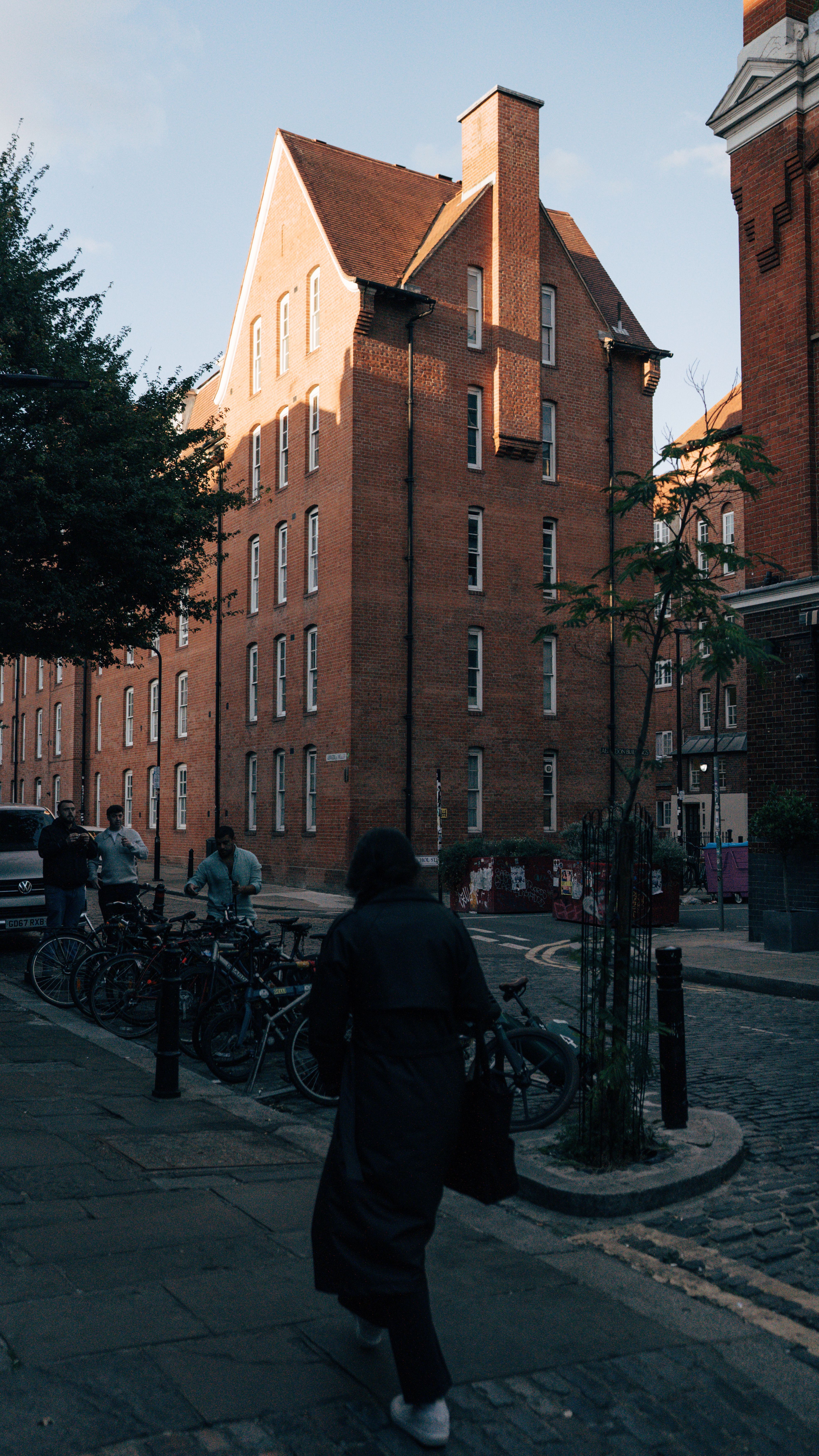 Red Brick Buildings along Cobblestone Street · Free Stock Photo