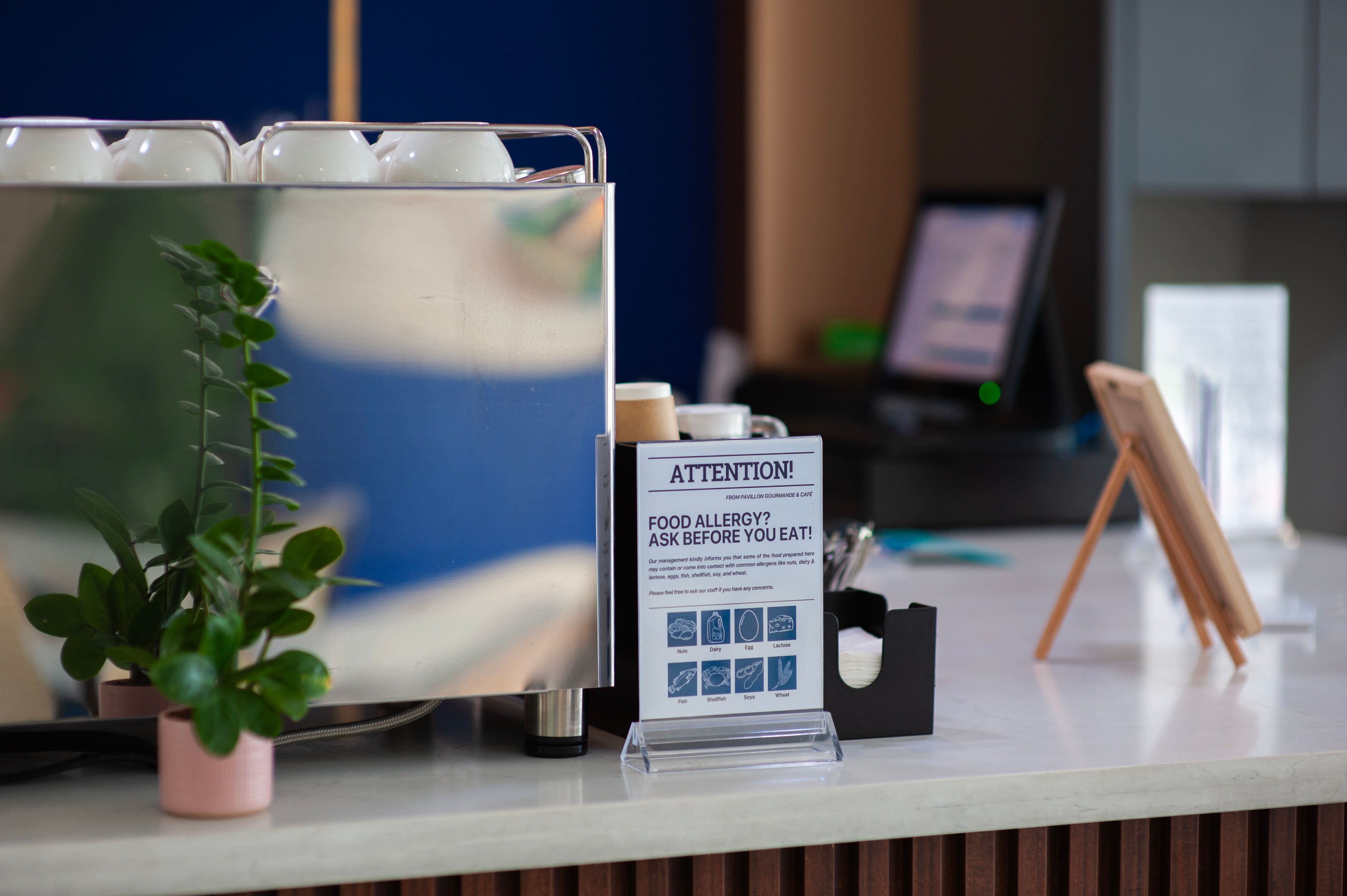 Coffee Shop Counter with Allergy Warning Sign · Free Stock Photo