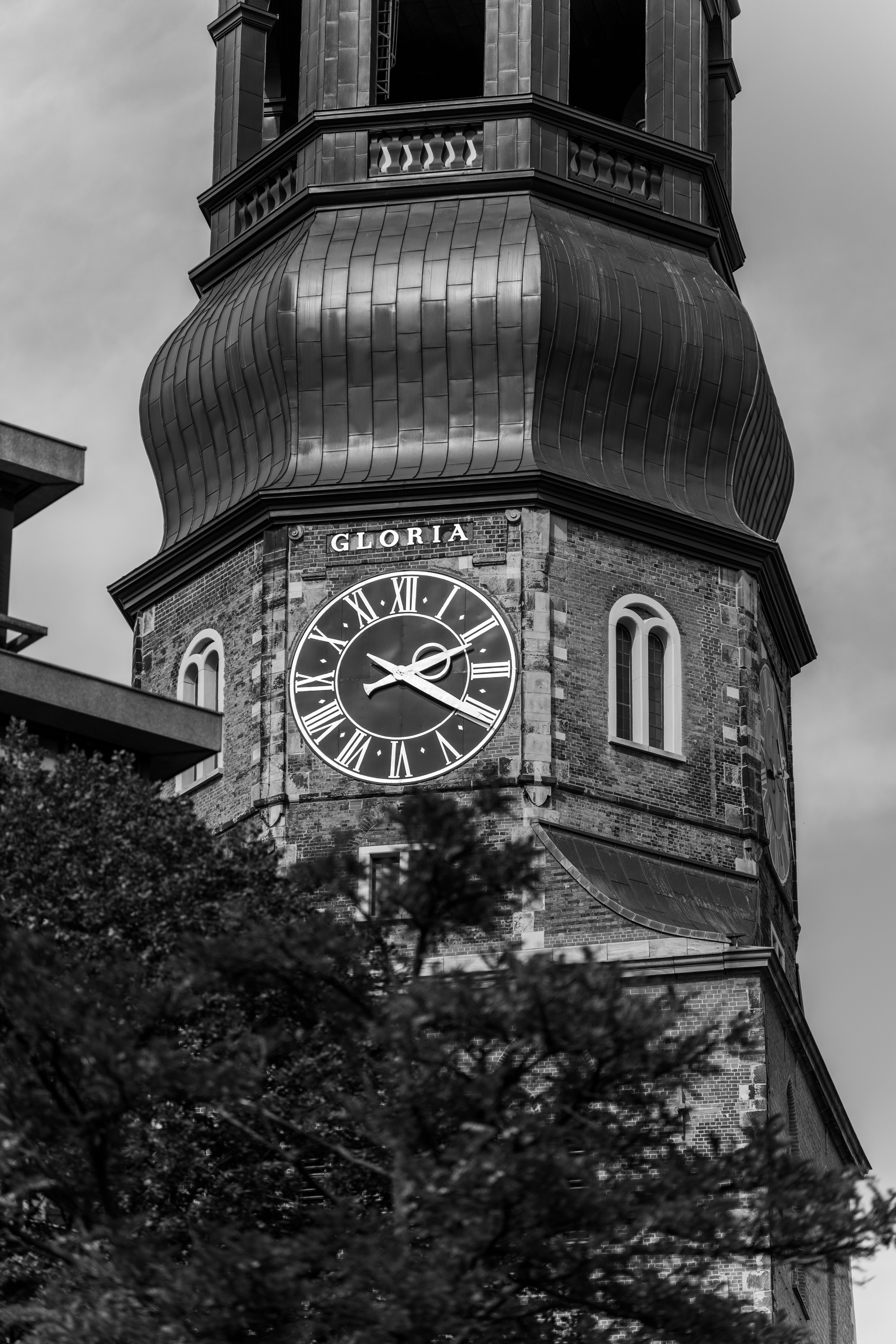 Gothic Clock Tower with 'Gloria' Inscription · Free Stock Photo