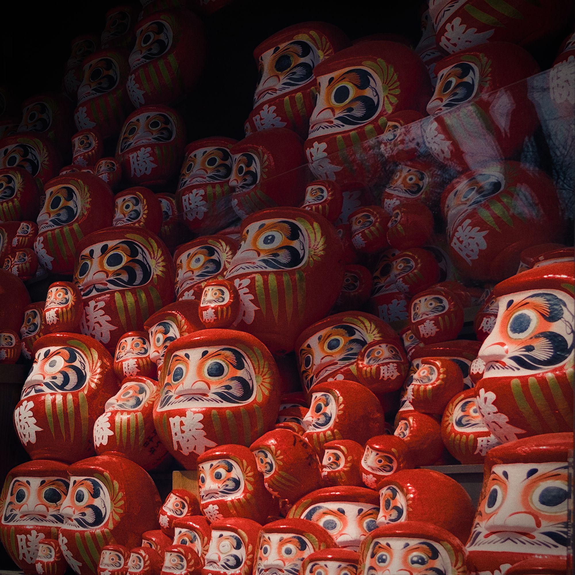 Vibrant Red Daruma Dolls Stacked in Japan · Free Stock Photo