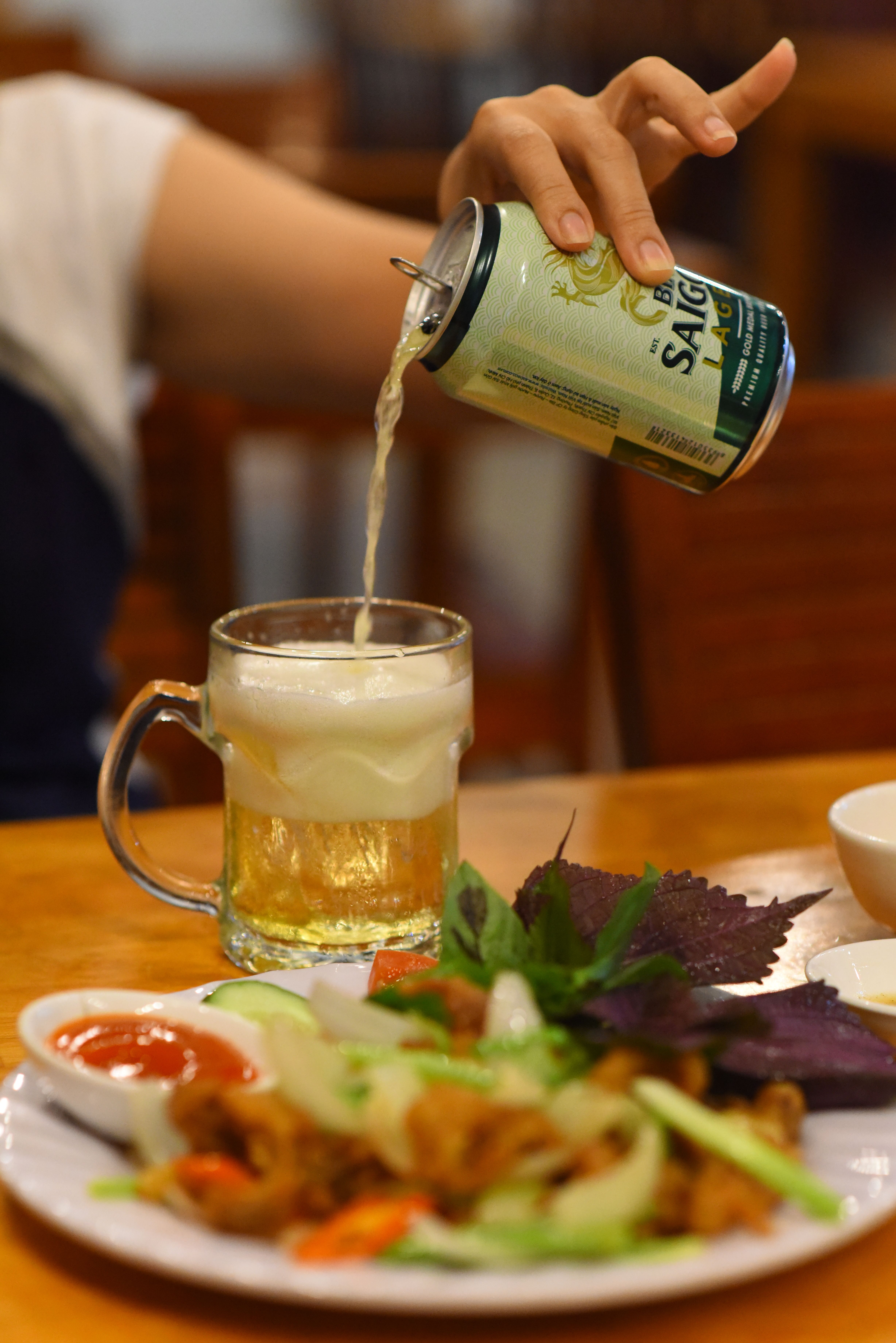 Refreshing Beer Poured with Authentic Asian Meal · Free Stock Photo