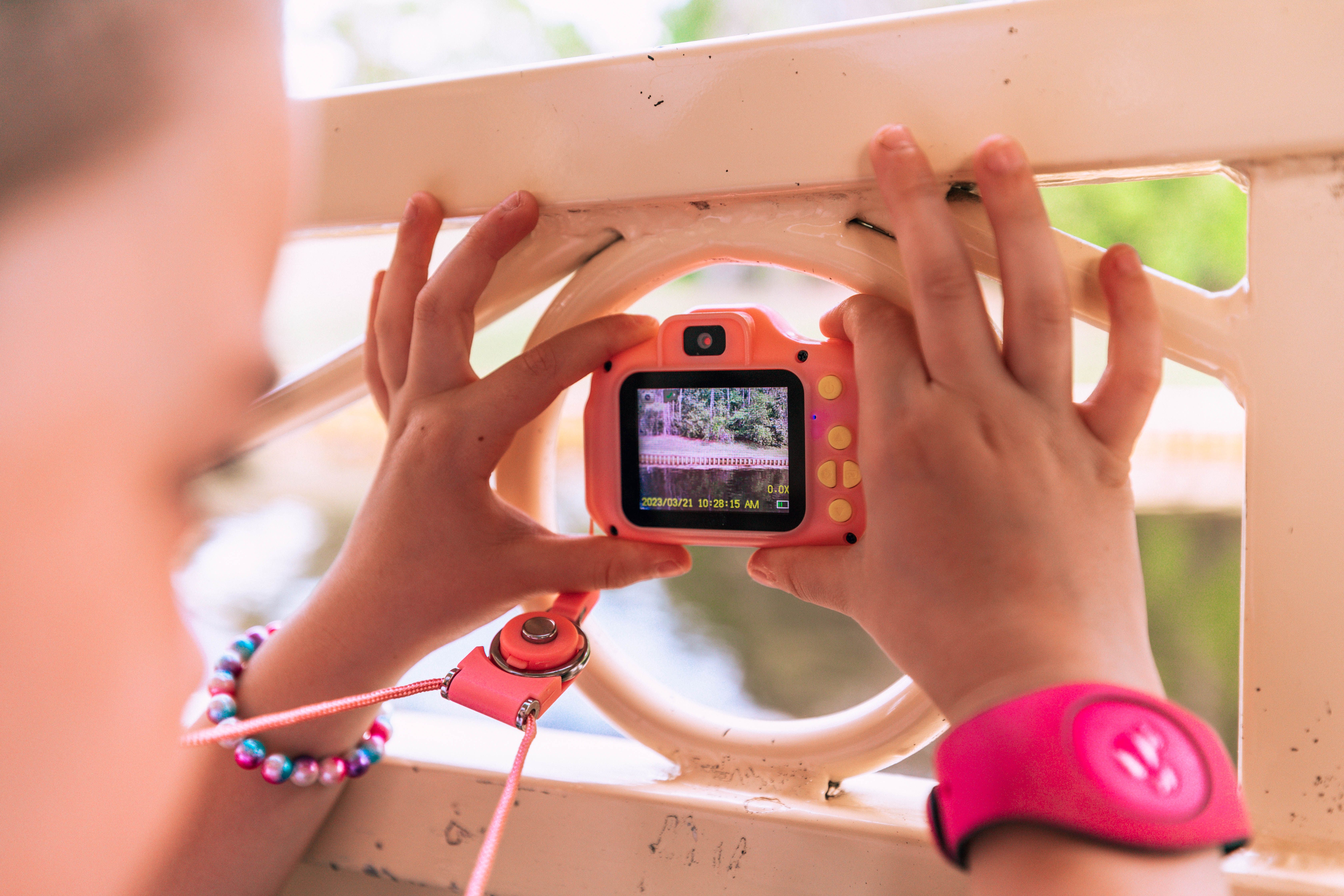 Child Photographing with Pink Camera Outdoors · Free Stock Photo