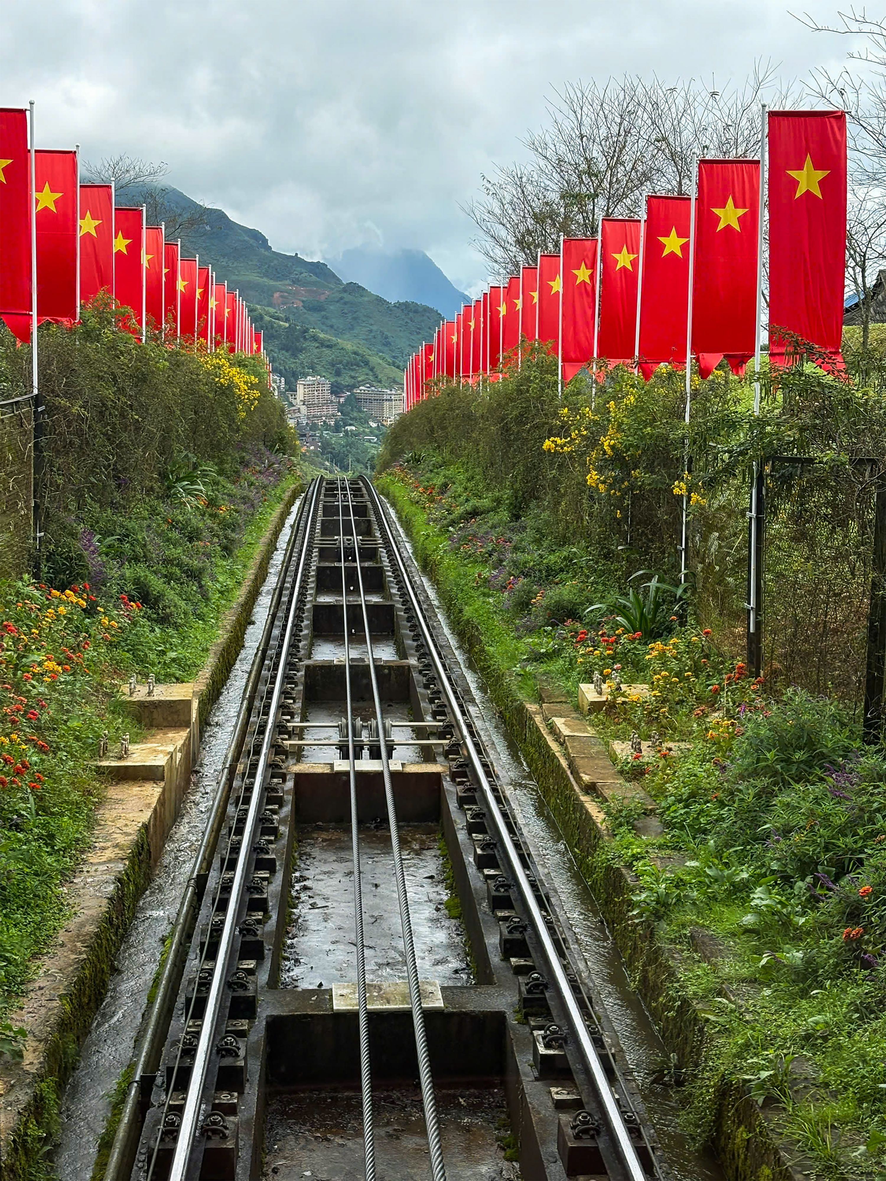Vietnamese Railway Surrounded by Red Flags · Free Stock Photo