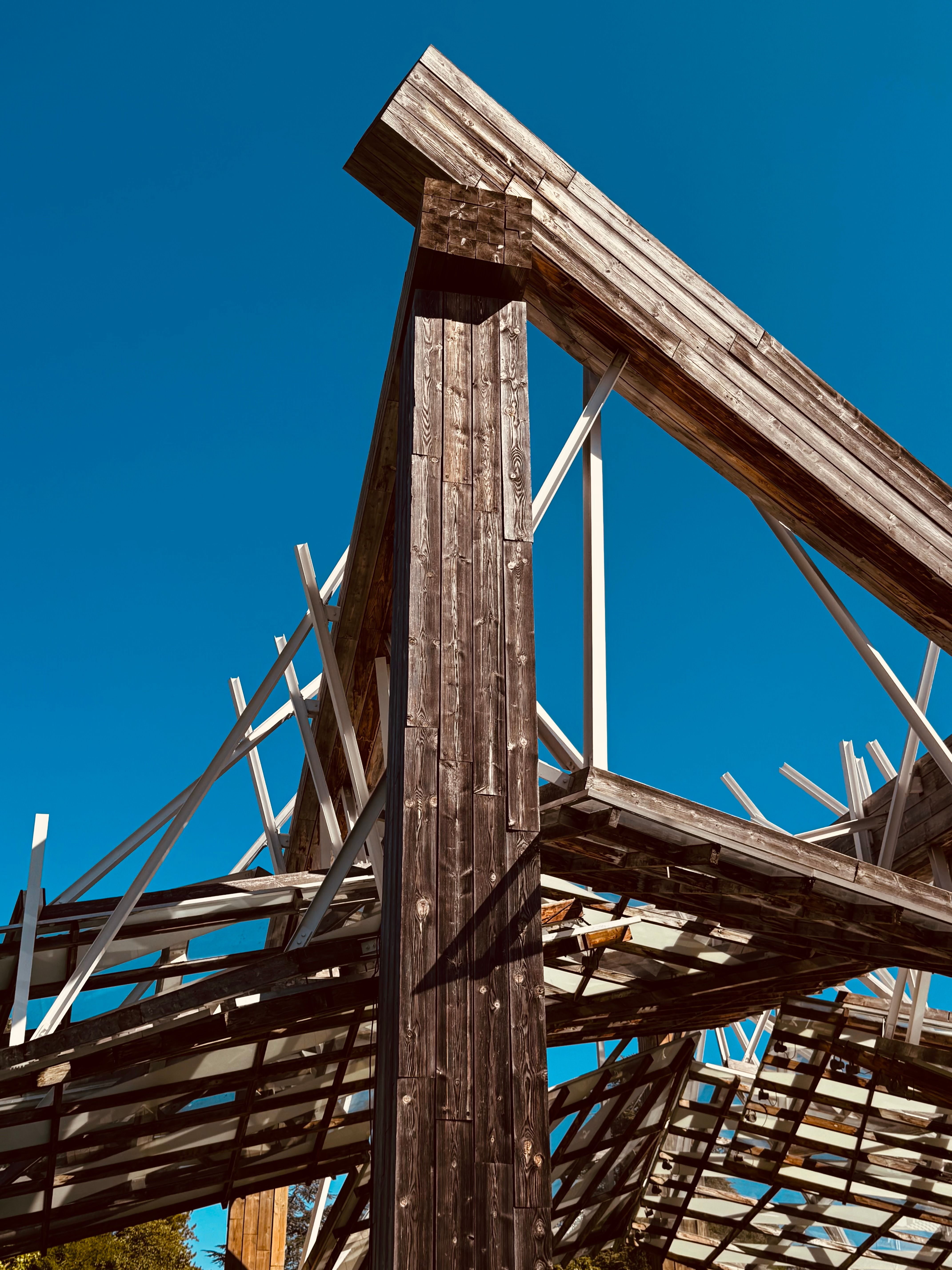 Rustic Wooden Structure Under Clear Blue Sky · Free Stock Photo