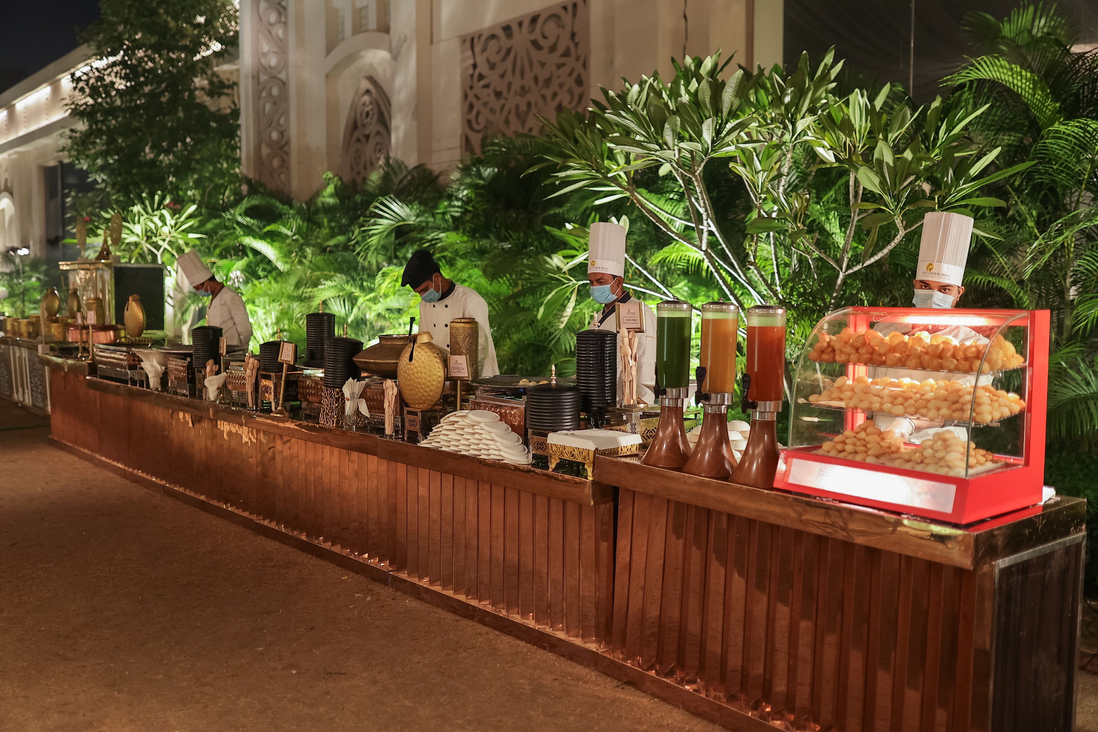 Outdoor Night Buffet with Chefs at Elegant Event · Free Stock Photo