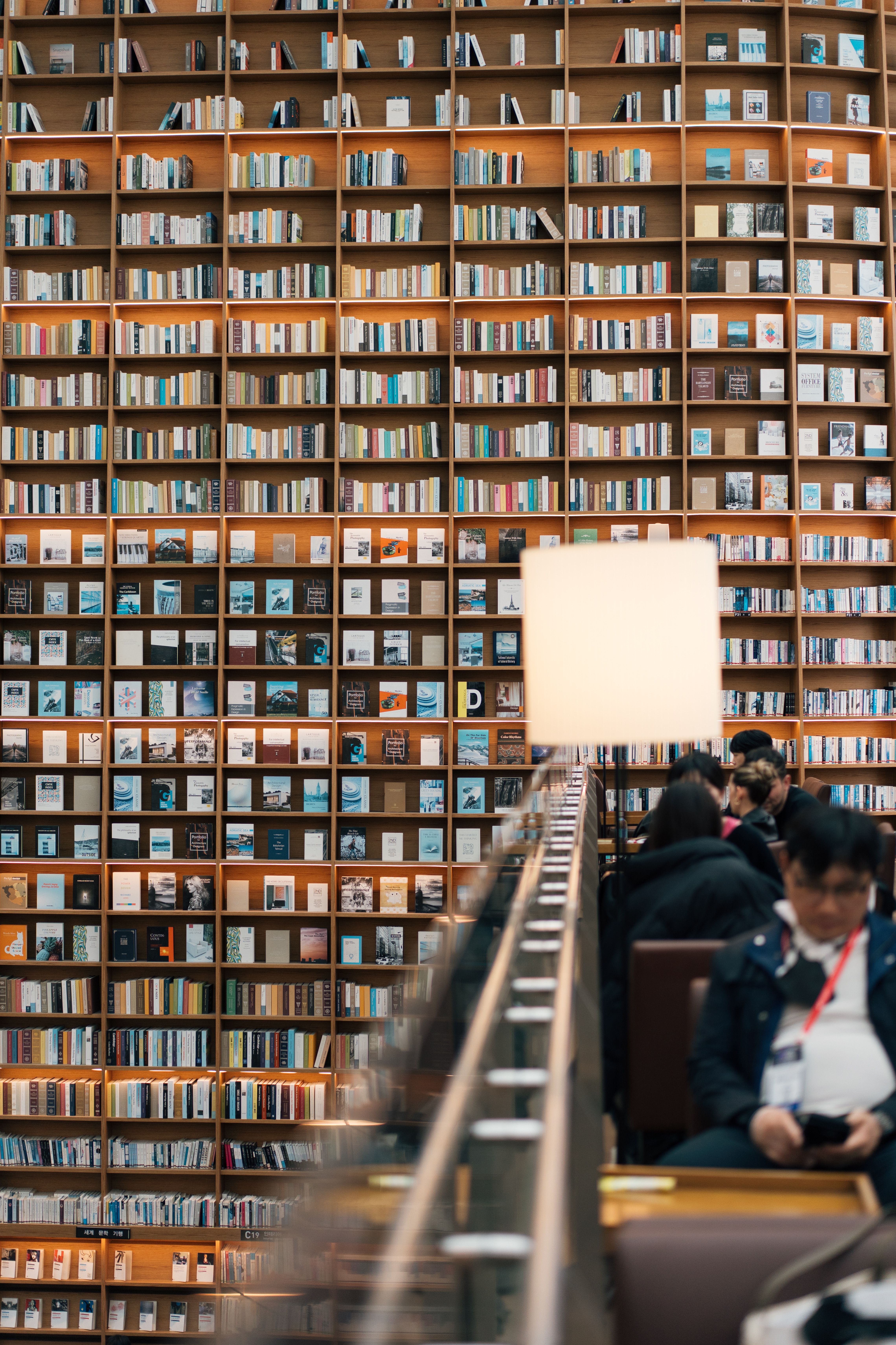 Modern Library Interior with Book Walls · Free Stock Photo