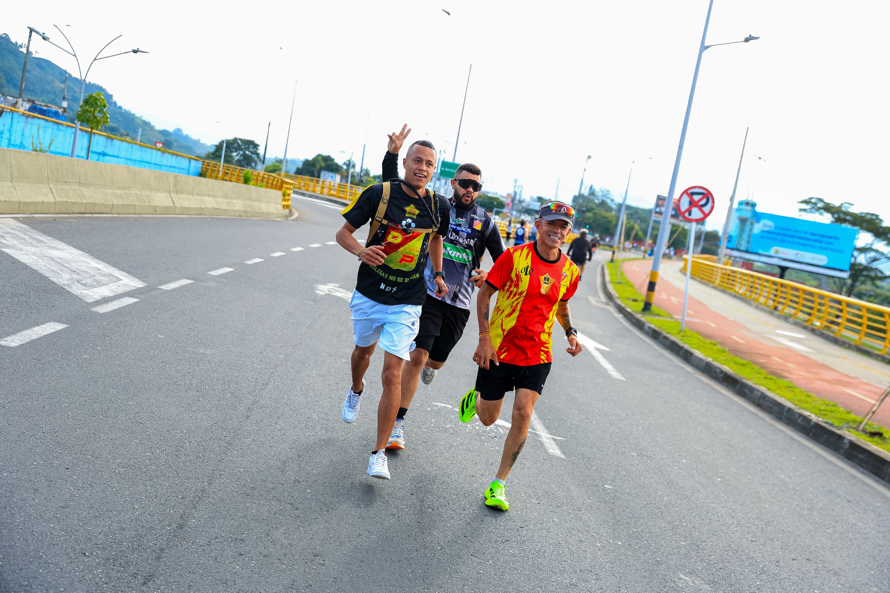 Group of Men Running in Outdoor Race Event · Free Stock Photo