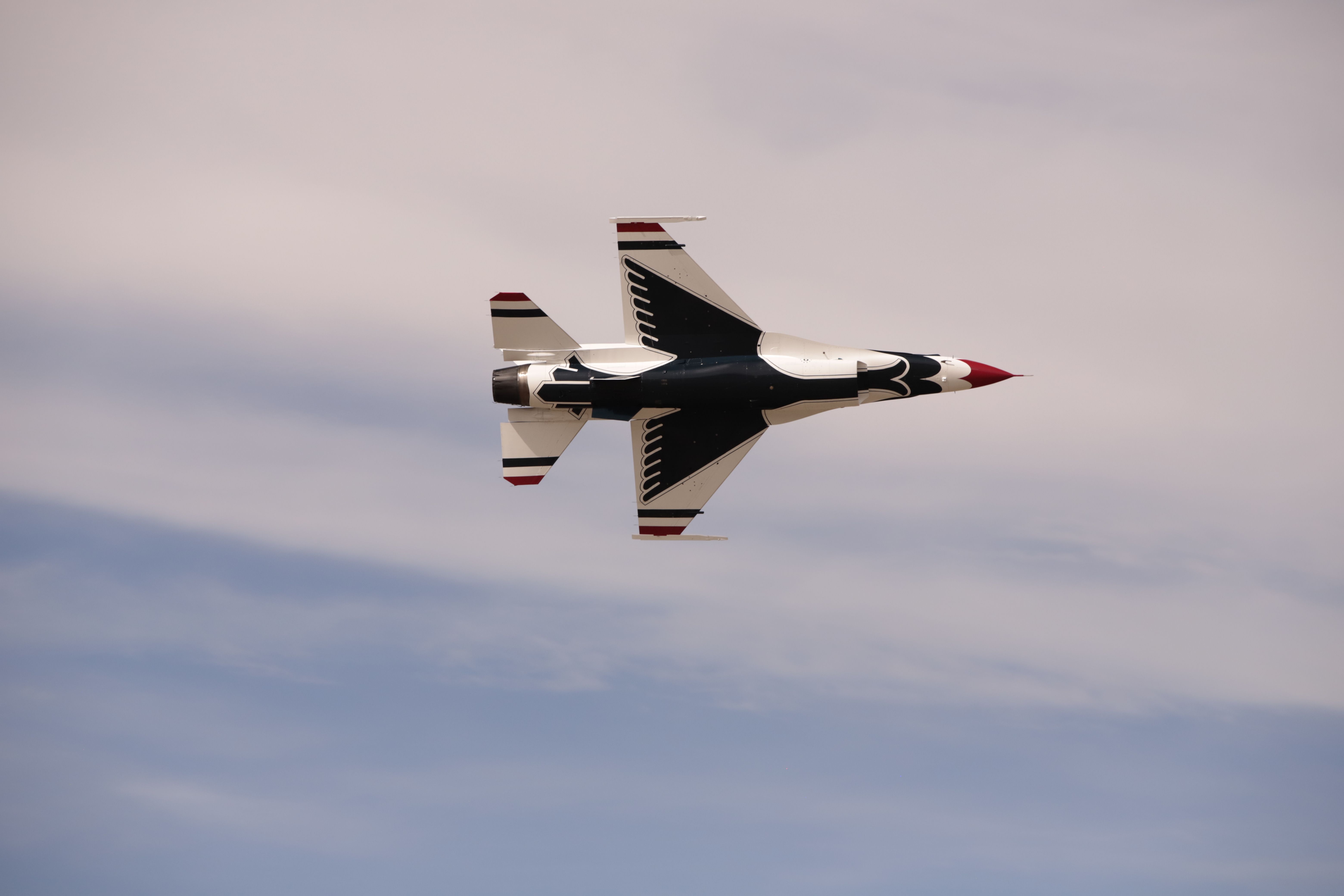 Aerobatic Jet Fighter Flying High in Clear Sky · Free Stock Photo