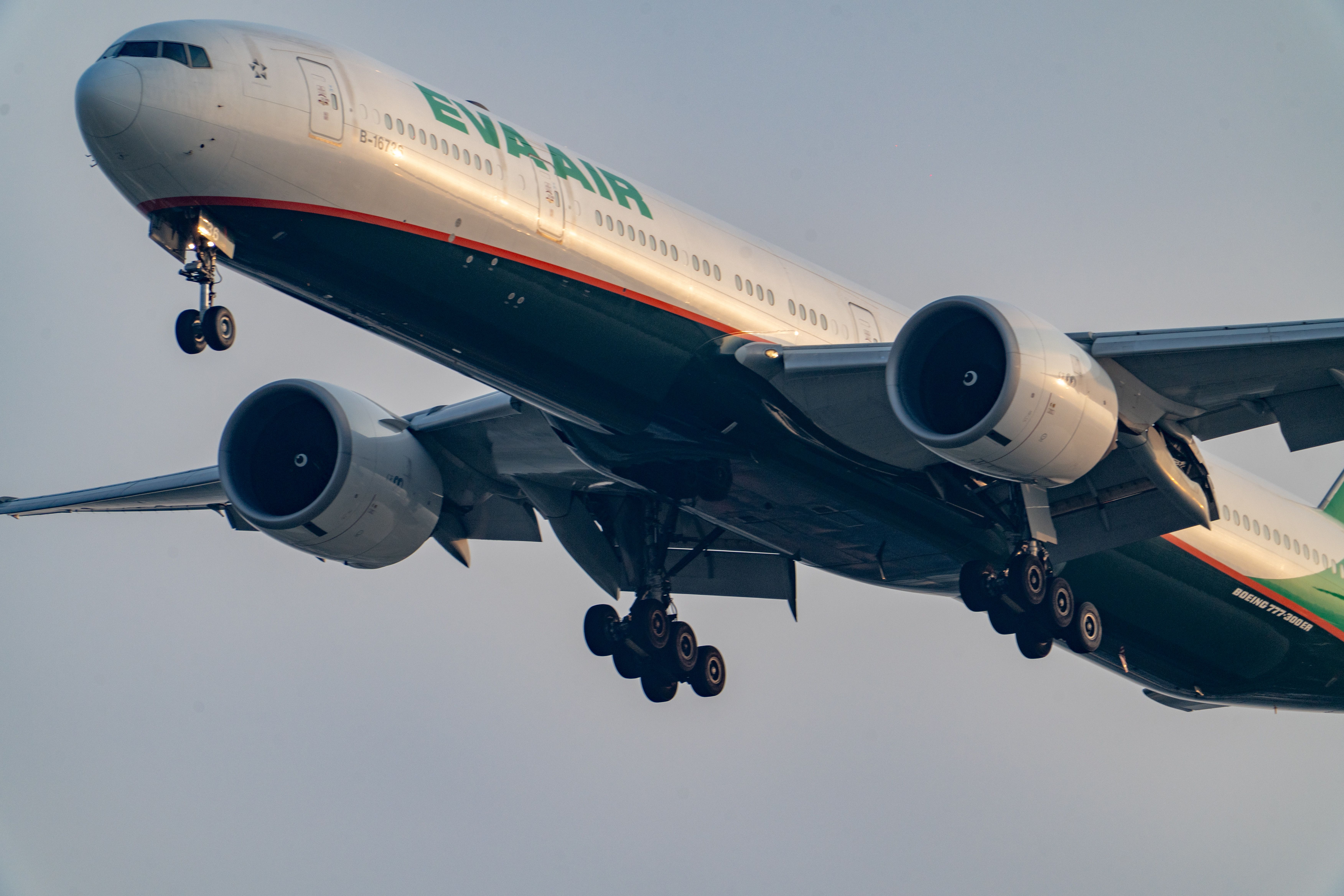 EVA Air Boeing 777 Landing at Sunset · Free Stock Photo