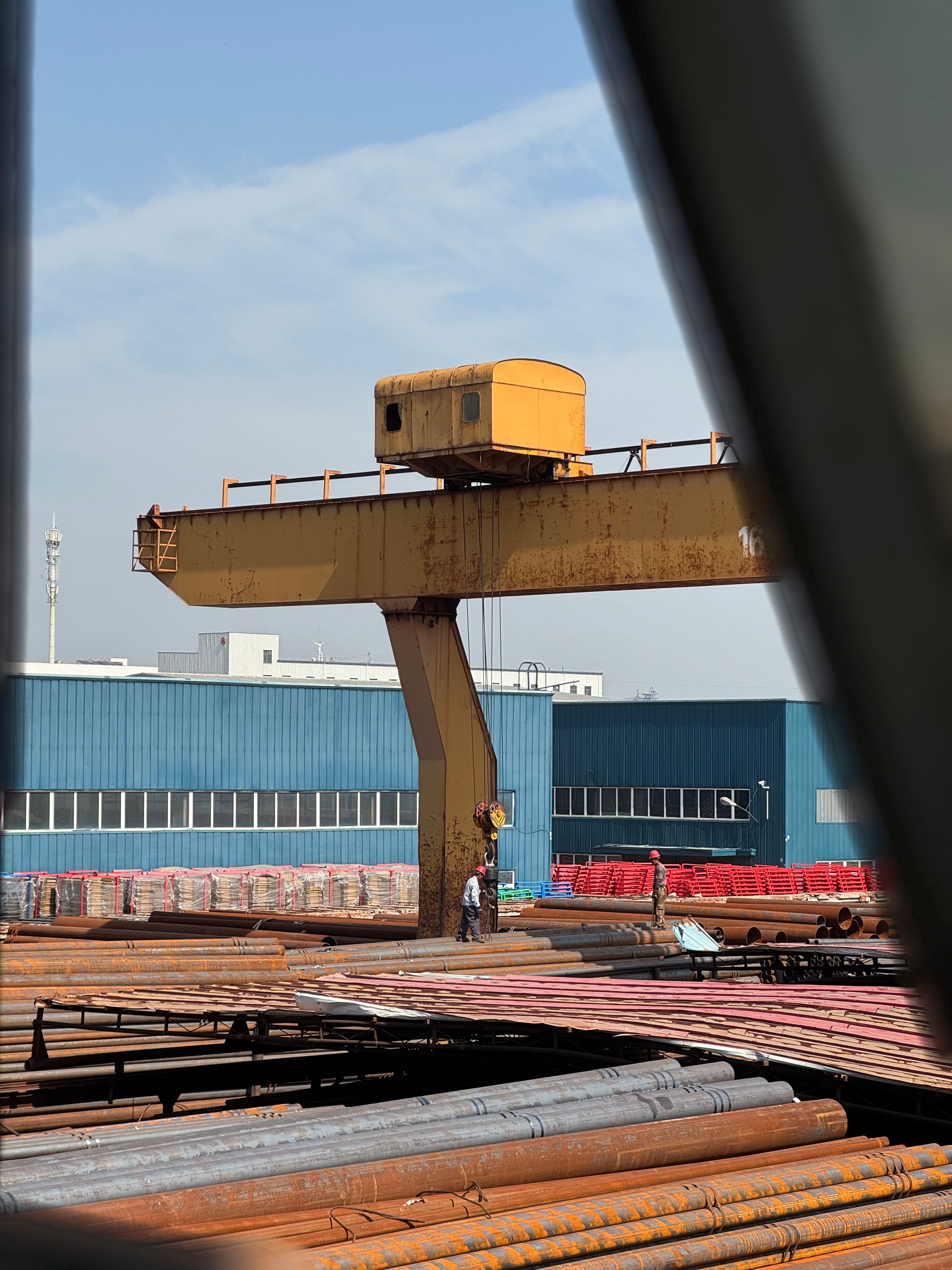 Industrial Crane in Steel Factory Yard · Free Stock Photo