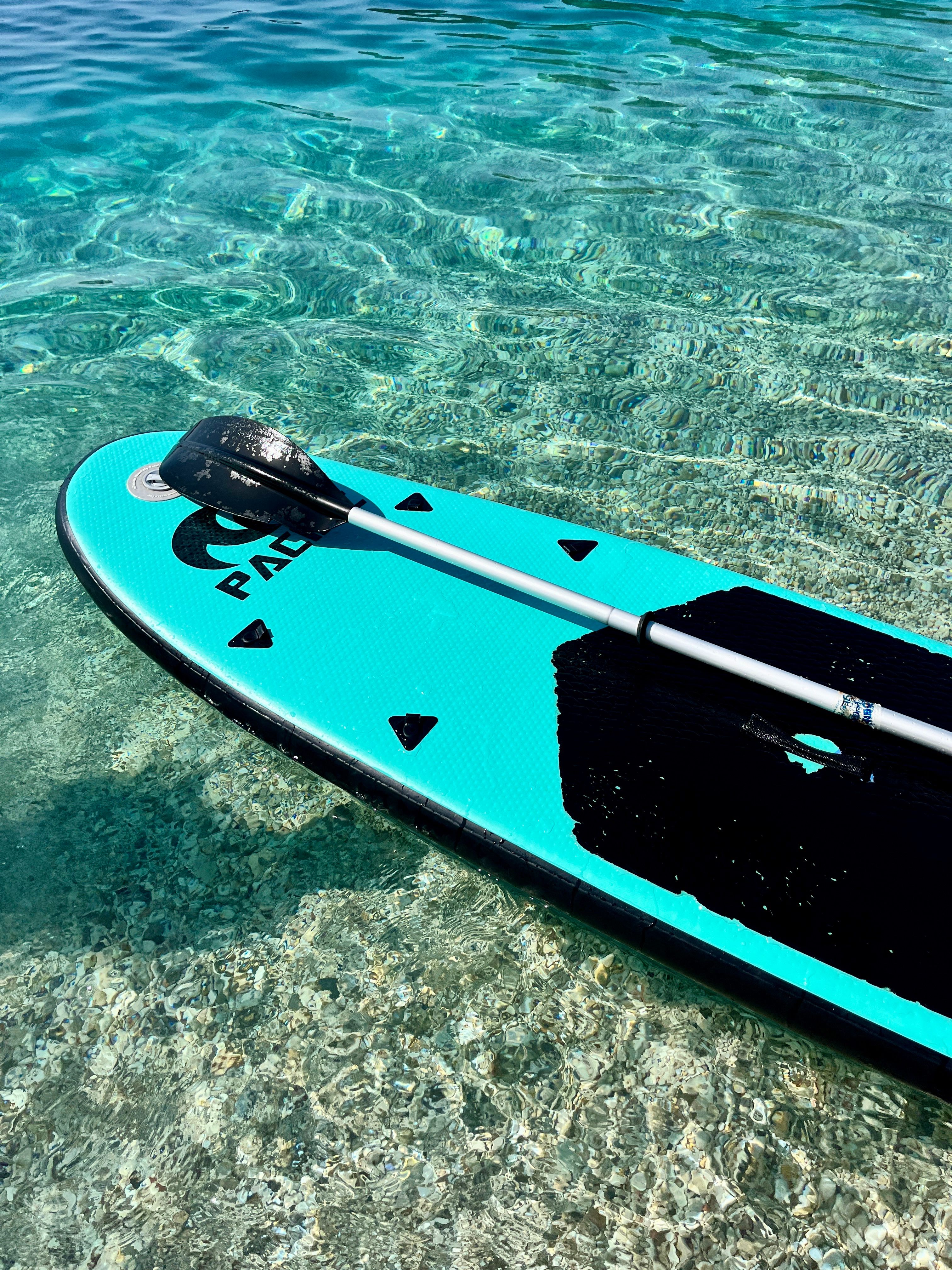 Turquoise Paddleboard on Crystal Clear Water · Free Stock Photo