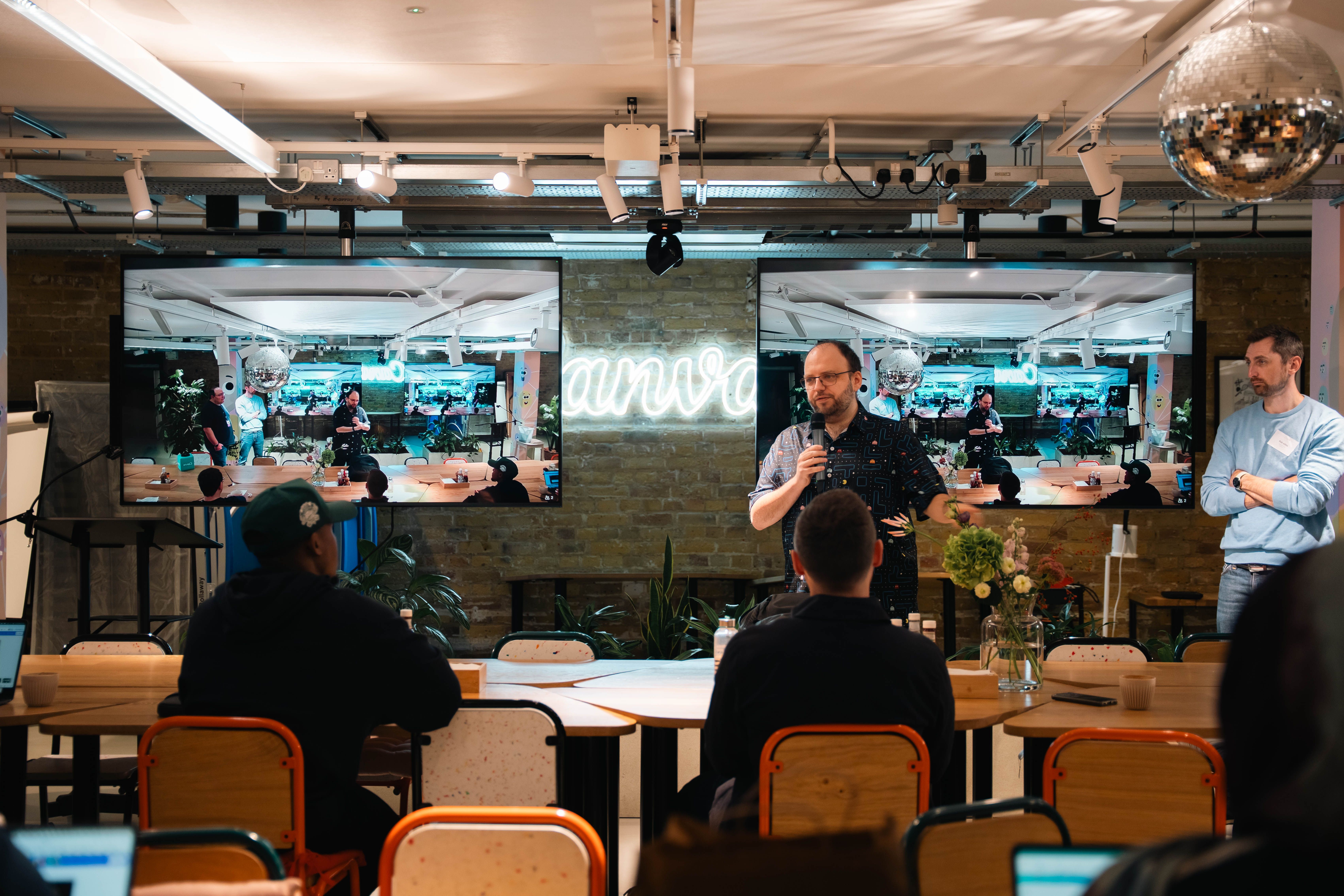 Indoor Conference with Speaker and Audience Interaction · Free Stock Photo