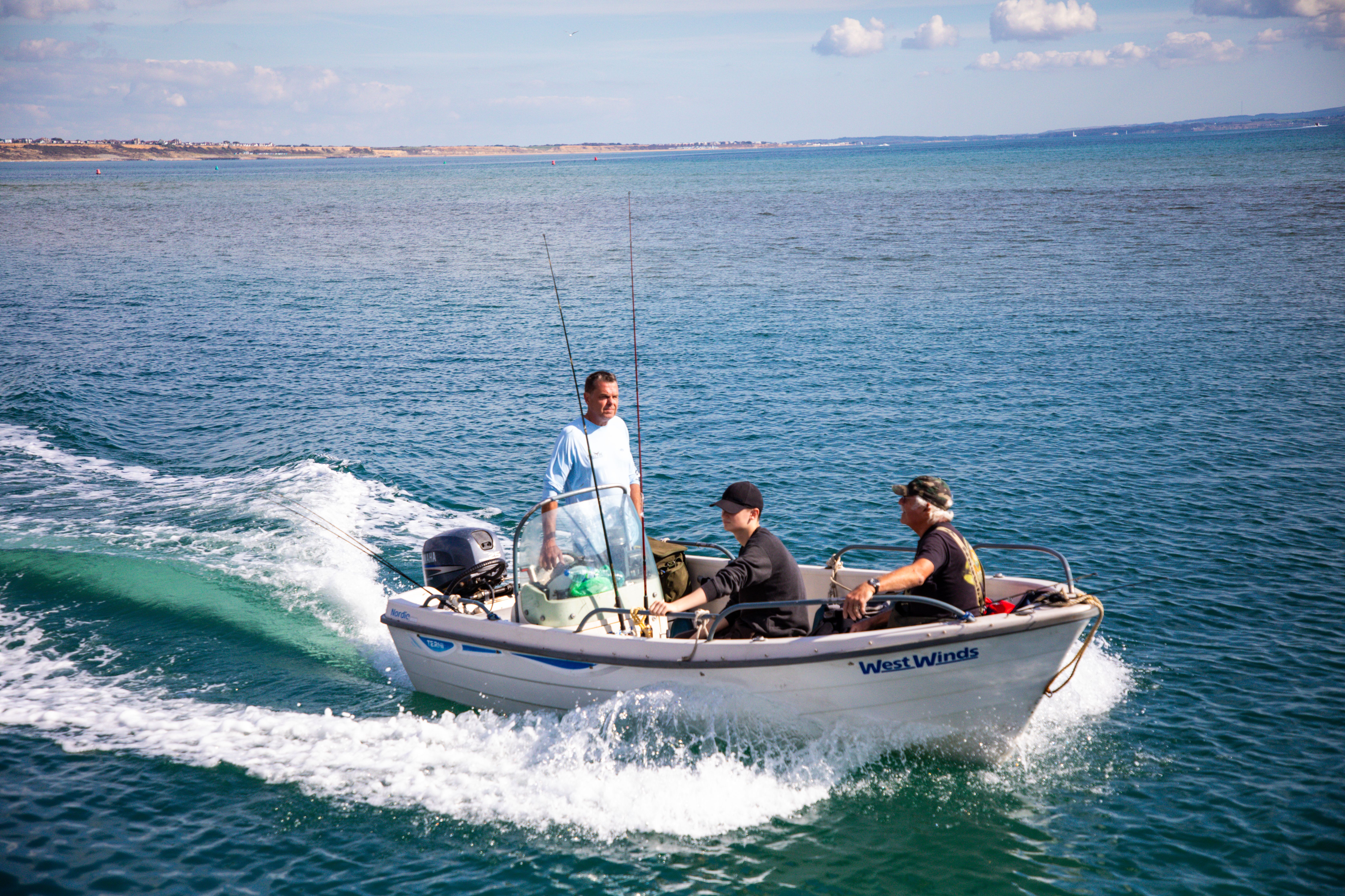 Three Men Fishing on Boat in English Waters · Free Stock Photo