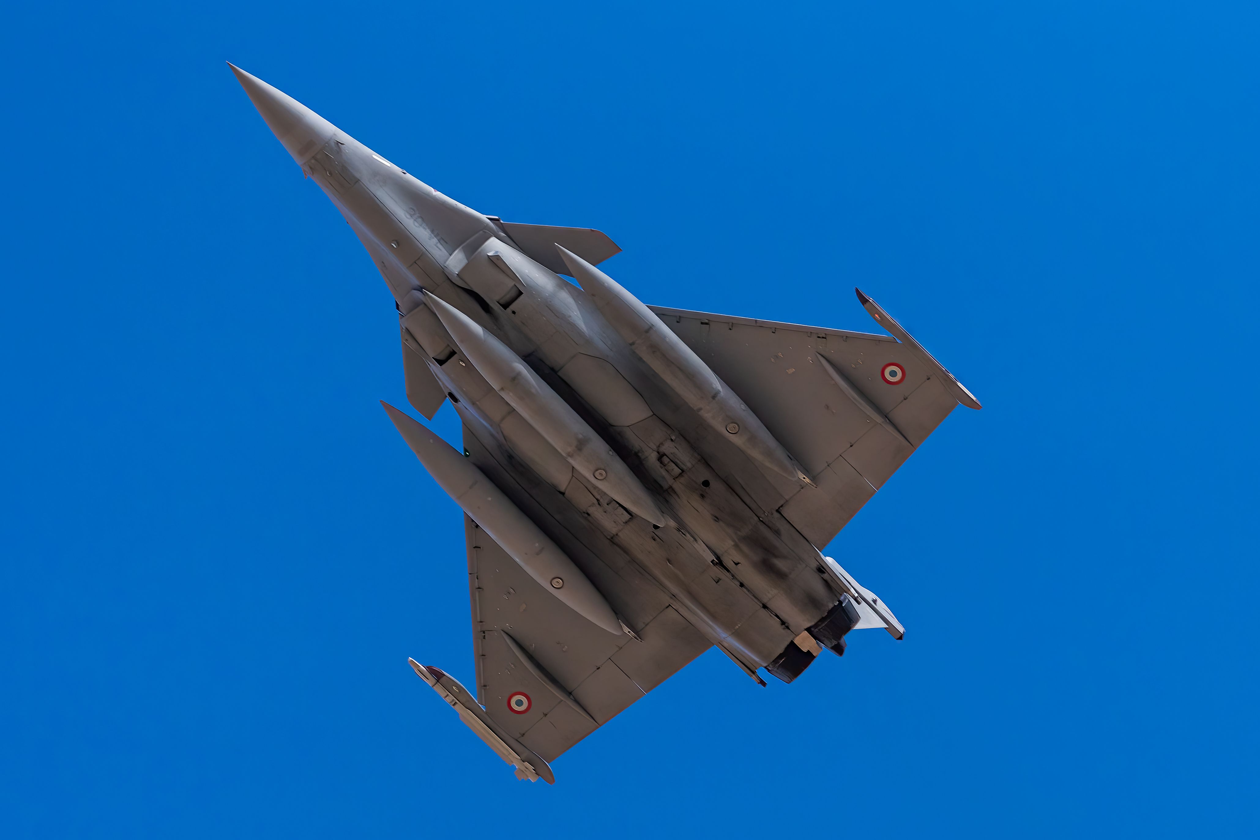 Military Jet Performing Aerial Maneuvers Under Blue Sky · Free Stock Photo