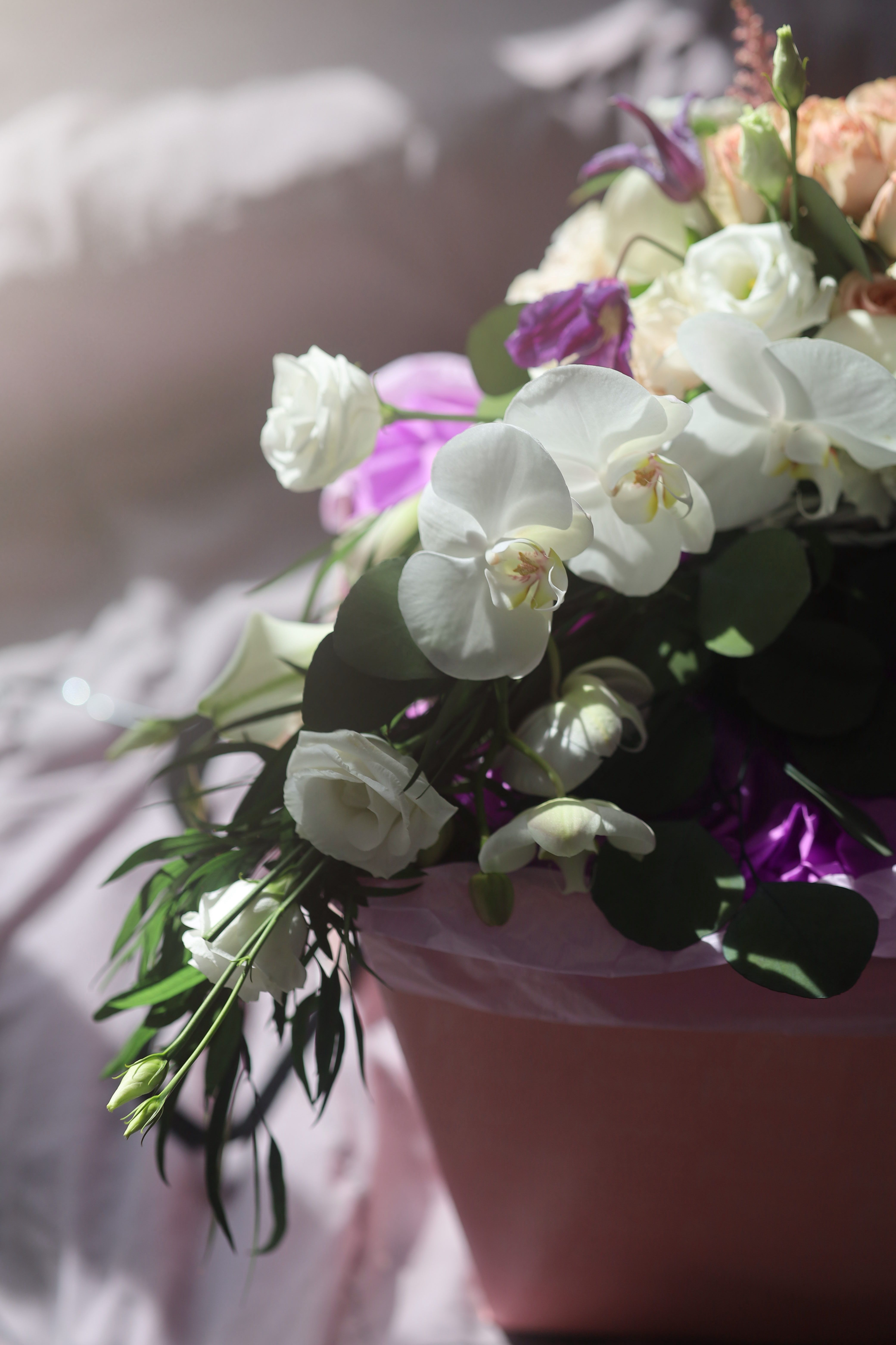 Elegant Floral Arrangement with Orchids and Roses · Free Stock Photo