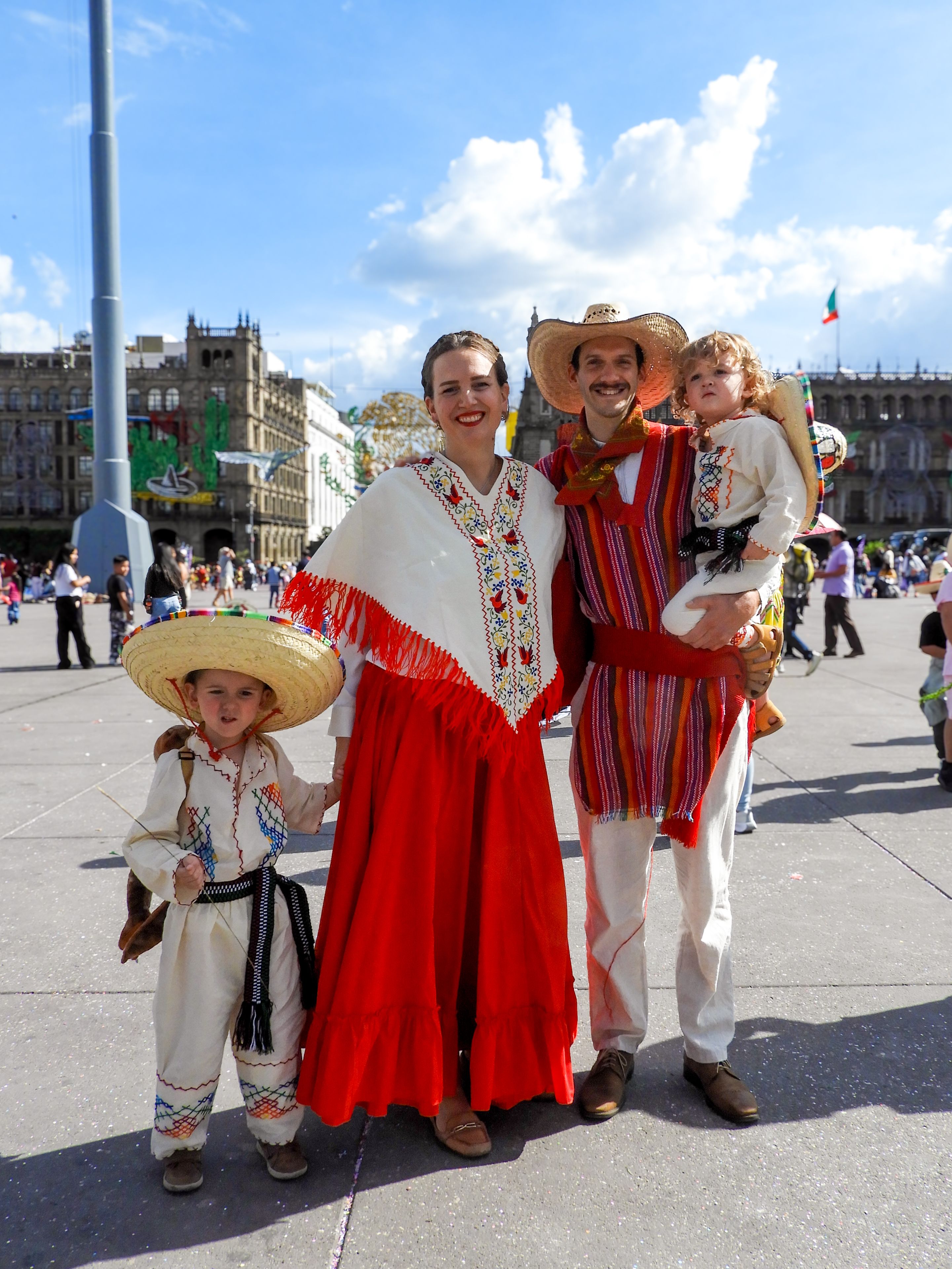 Family in Traditional Mexican Attire at Zócalo · Free Stock Photo