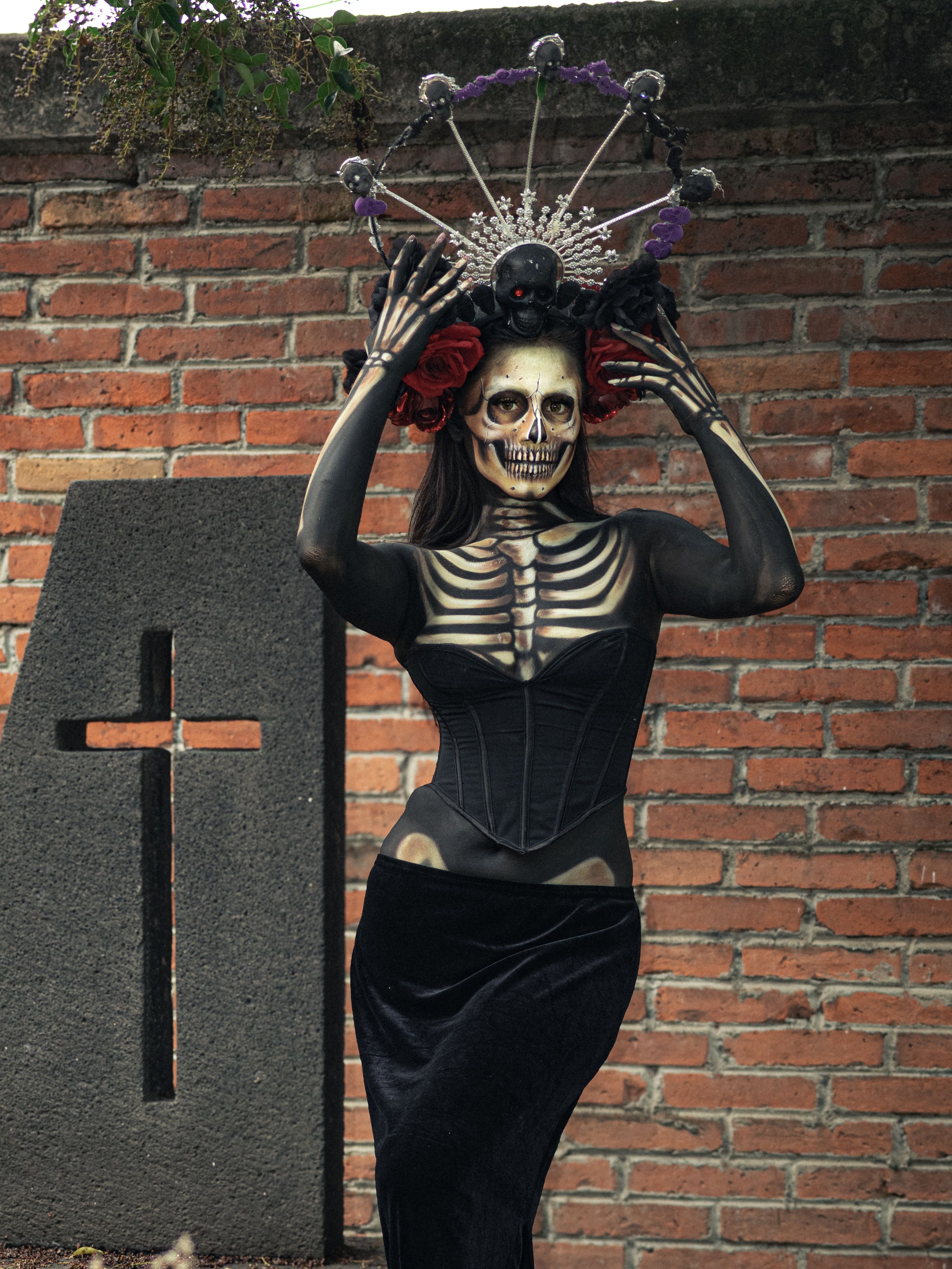 Skeleton Costume with Intricate Headpiece in Cemetery · Free Stock Photo