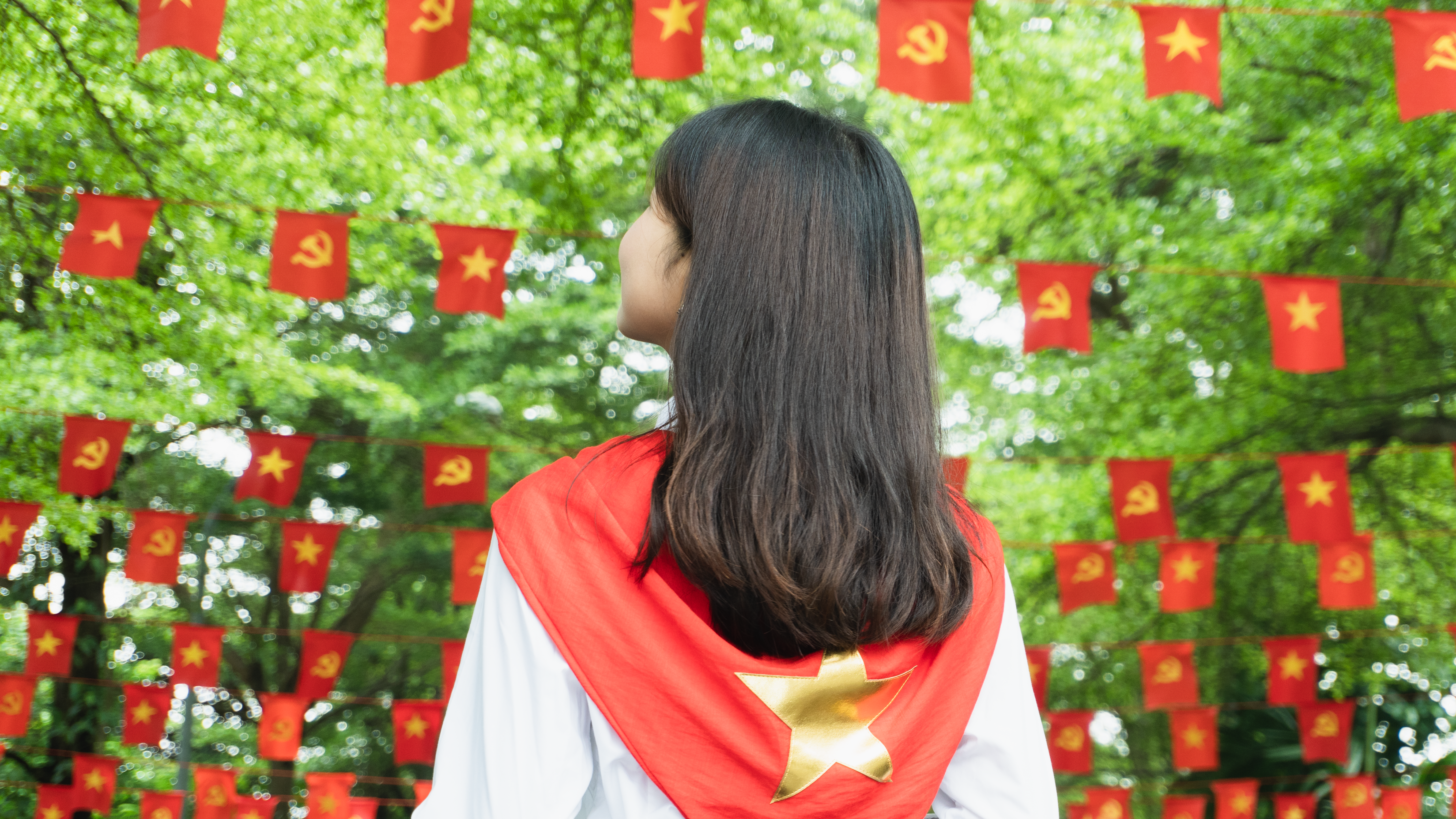 Young Girl Admiring Communist Banners Outdoor · Free Stock Photo