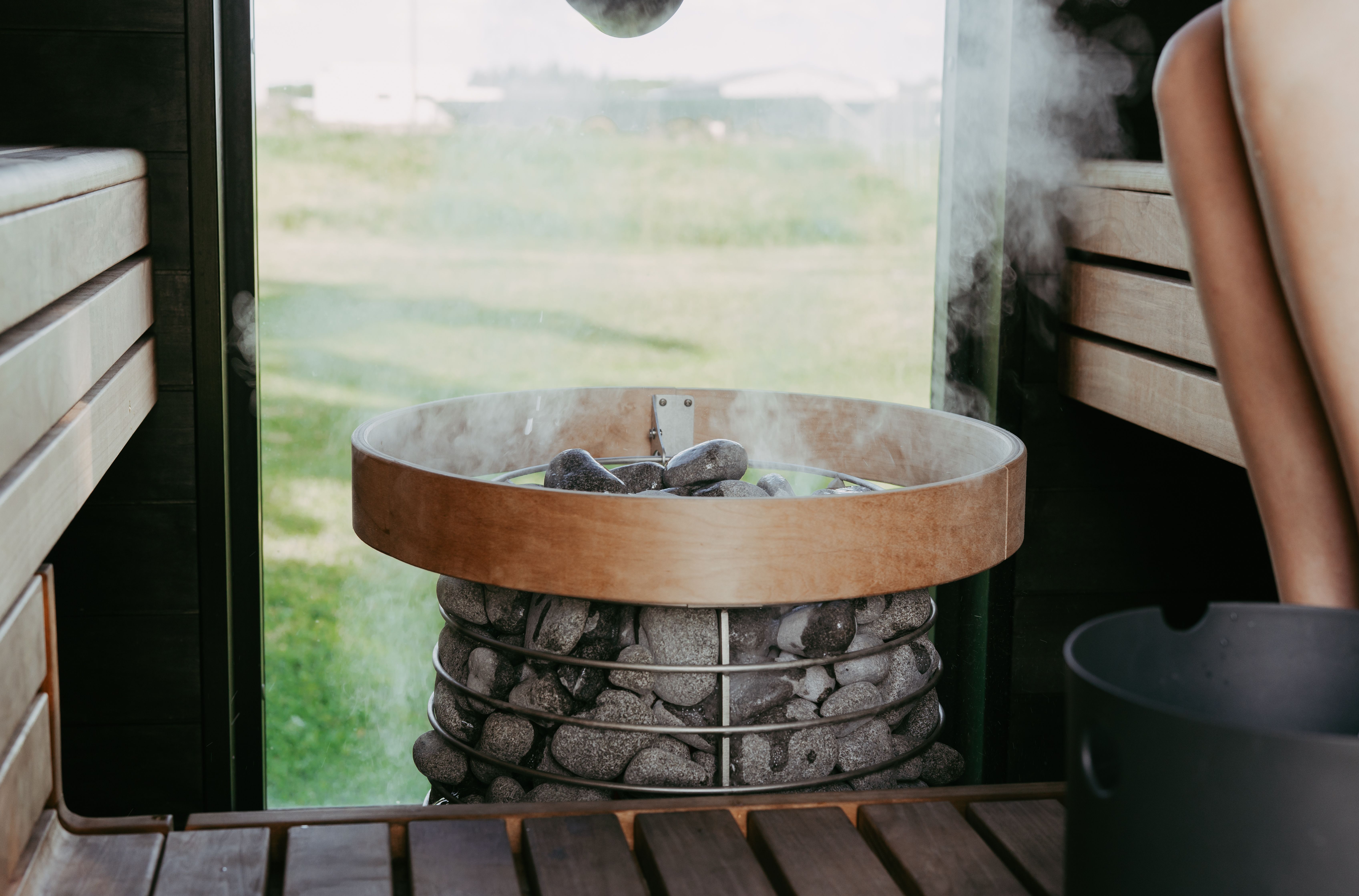 Cozy Indoor Sauna with Steaming Stones · Free Stock Photo