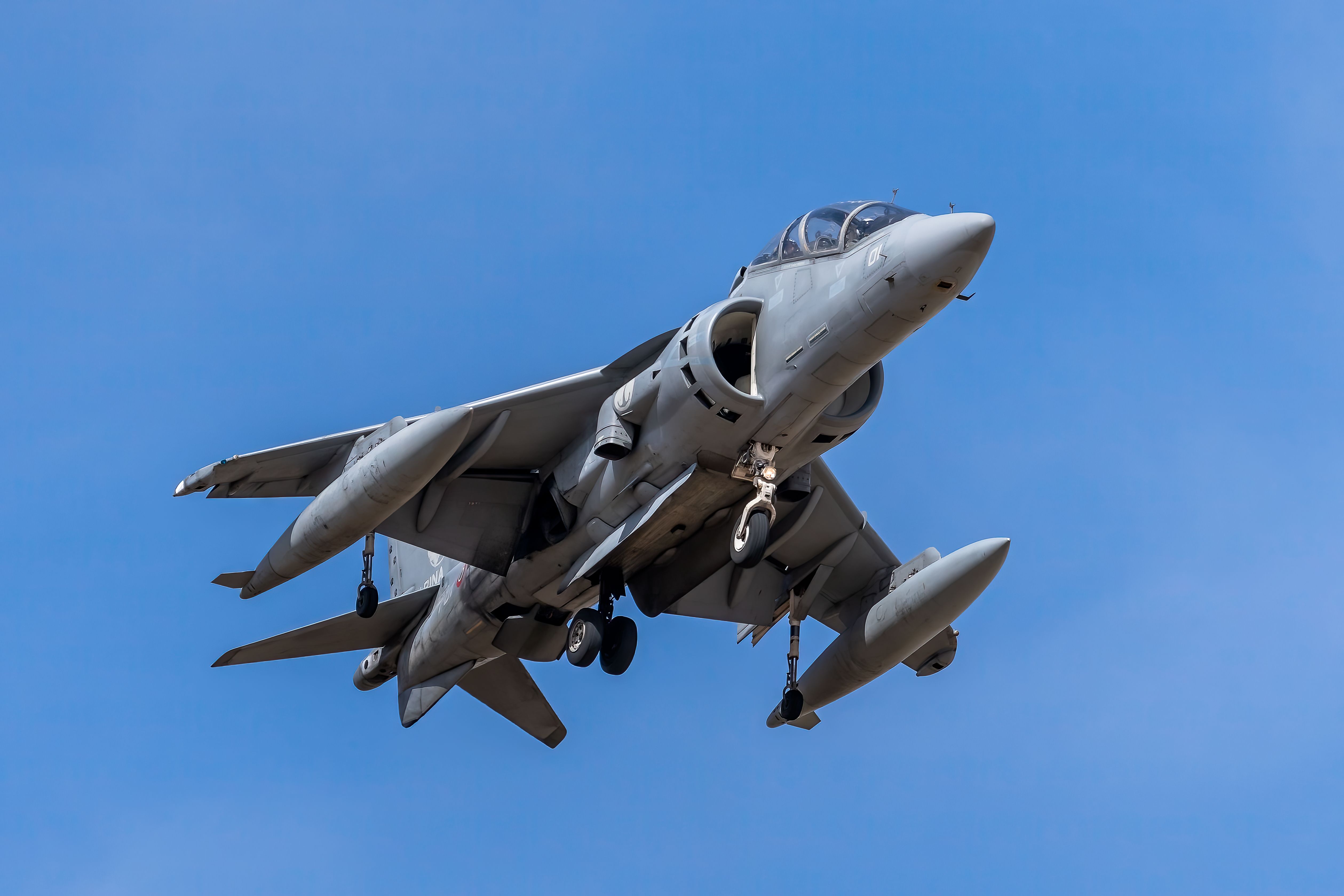 Military Jet Soaring High Over Blue Sky · Free Stock Photo