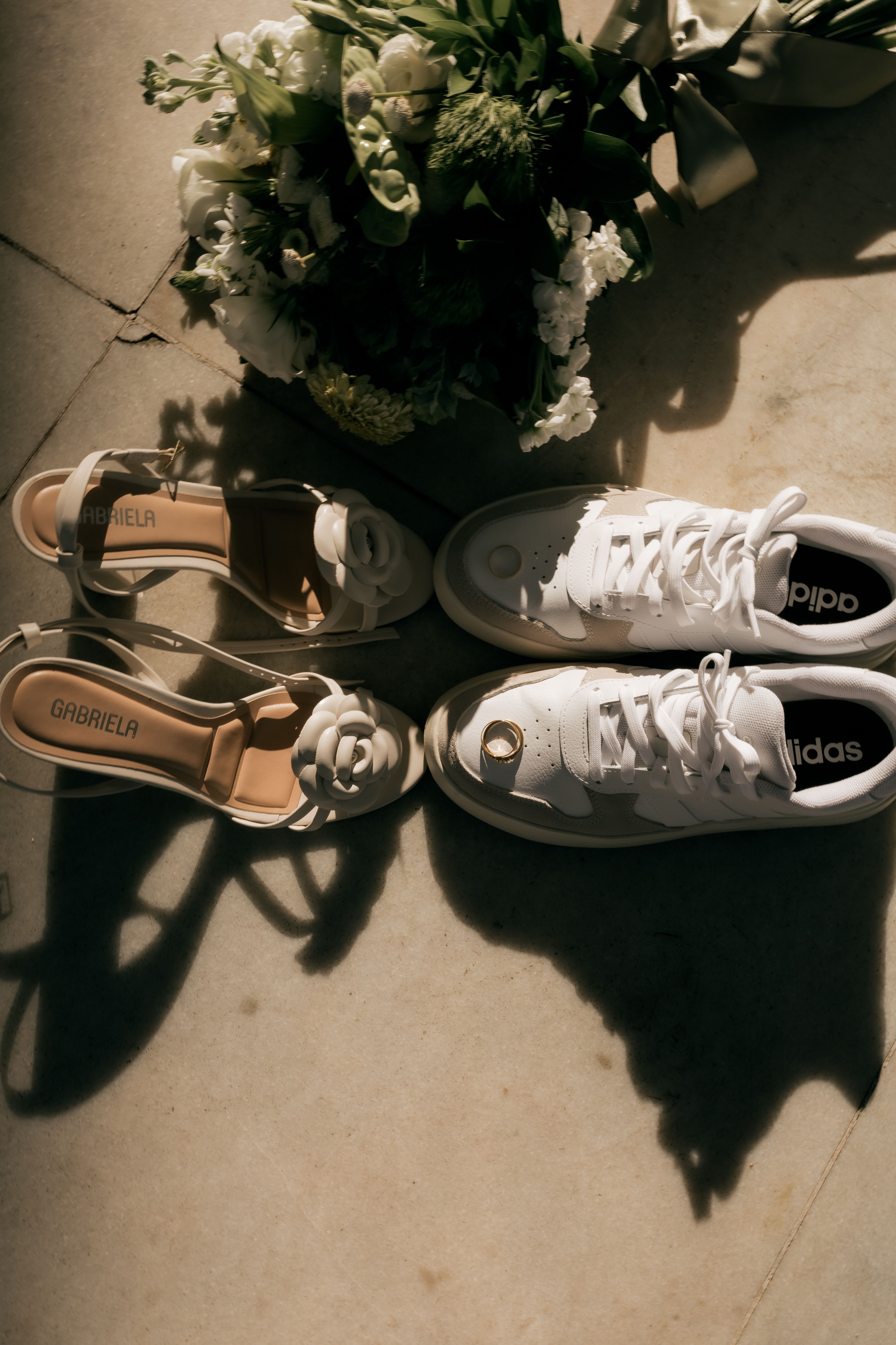 Elegant Wedding Shoes and Bouquet in Sunlight · Free Stock Photo