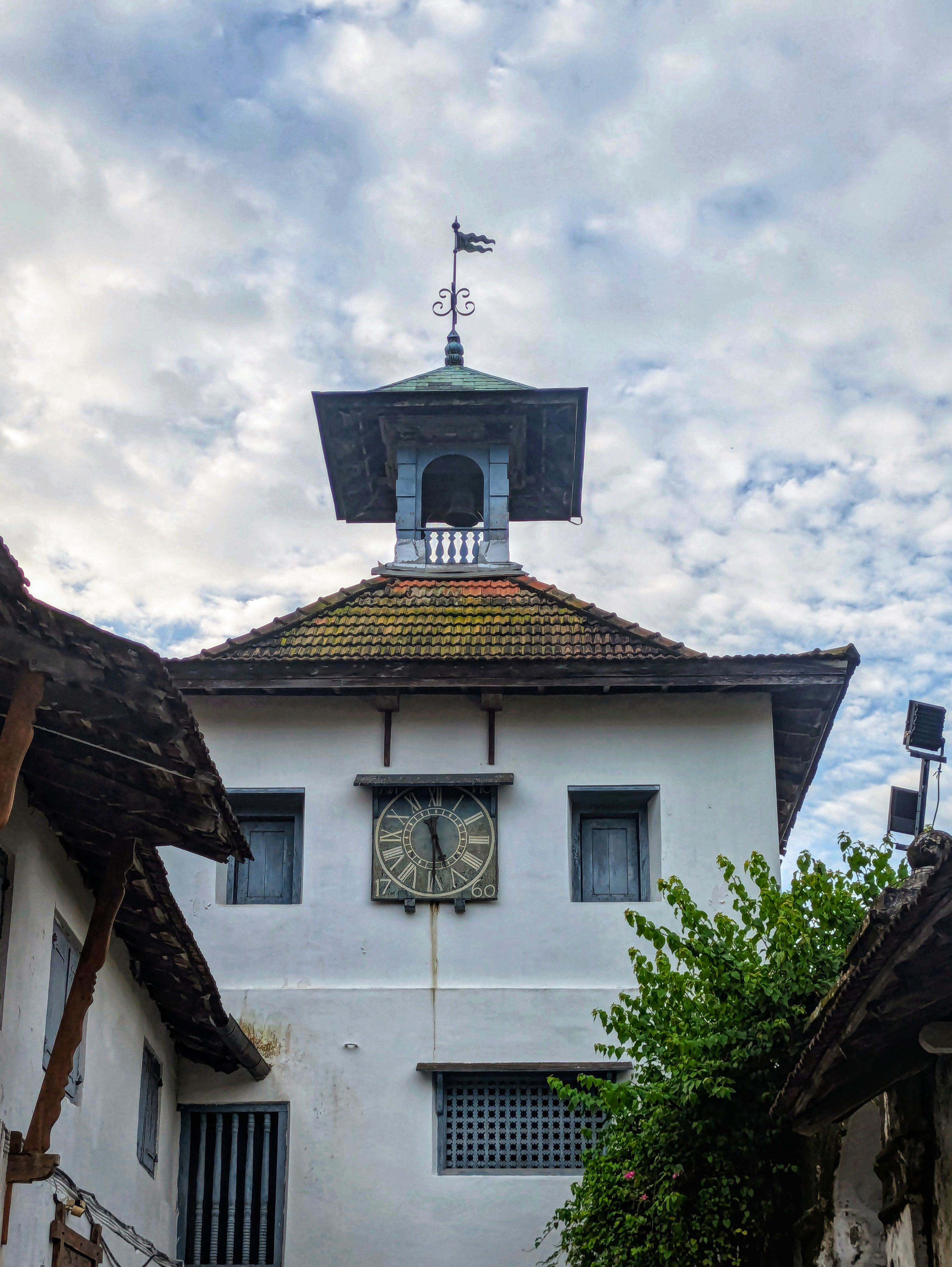 Historic Clock Tower with Weather Vane · Free Stock Photo