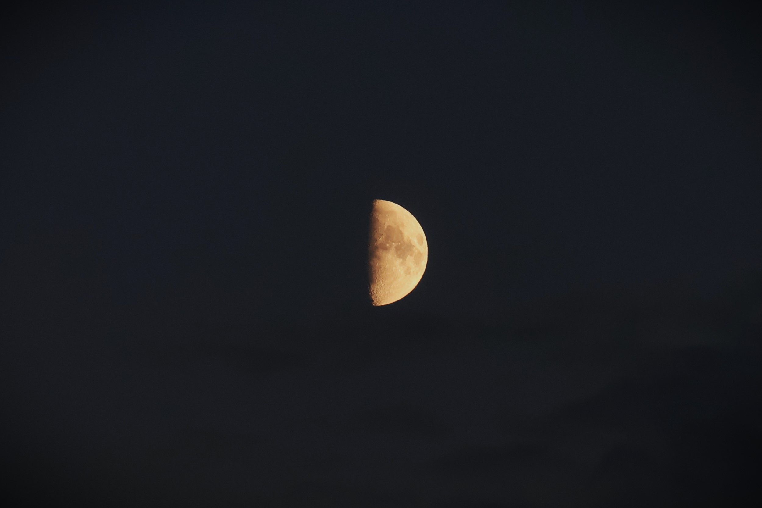 Half Moon in Night Sky against Dark Background · Free Stock Photo