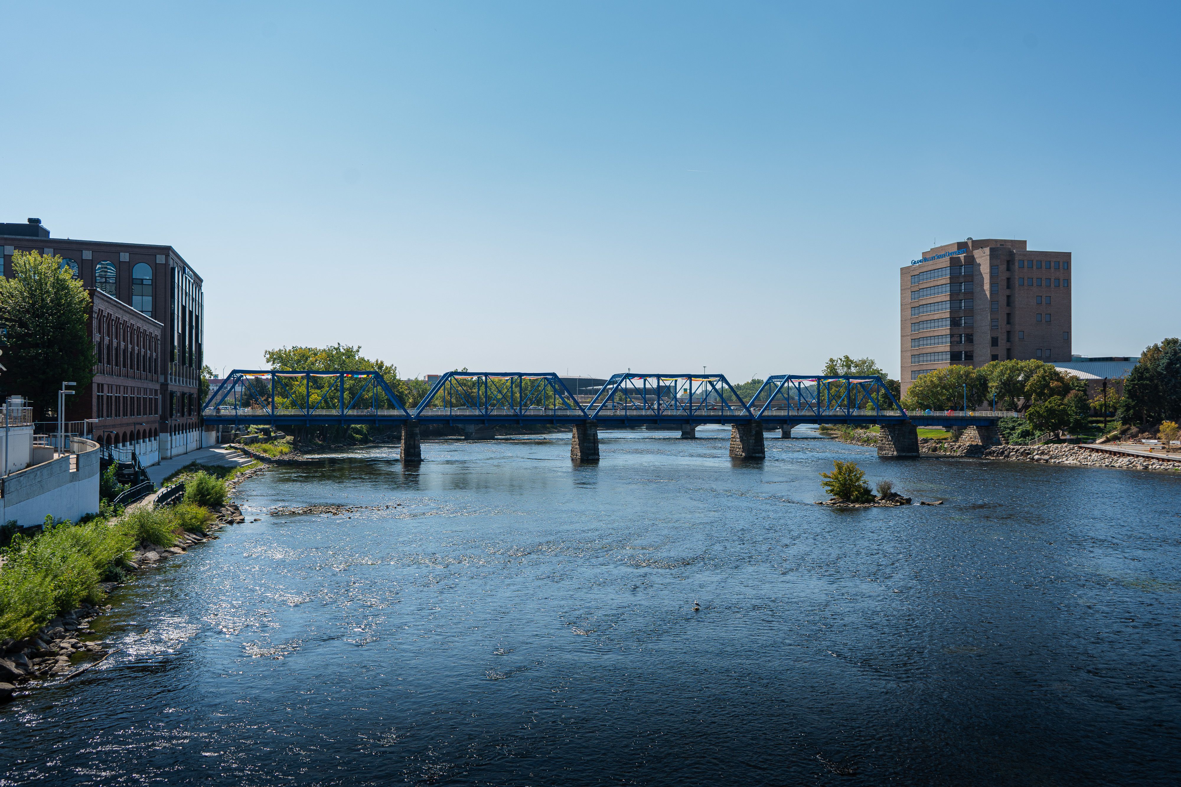 Iconic Blue Bridge Over Grand Rapids River · Free Stock Photo