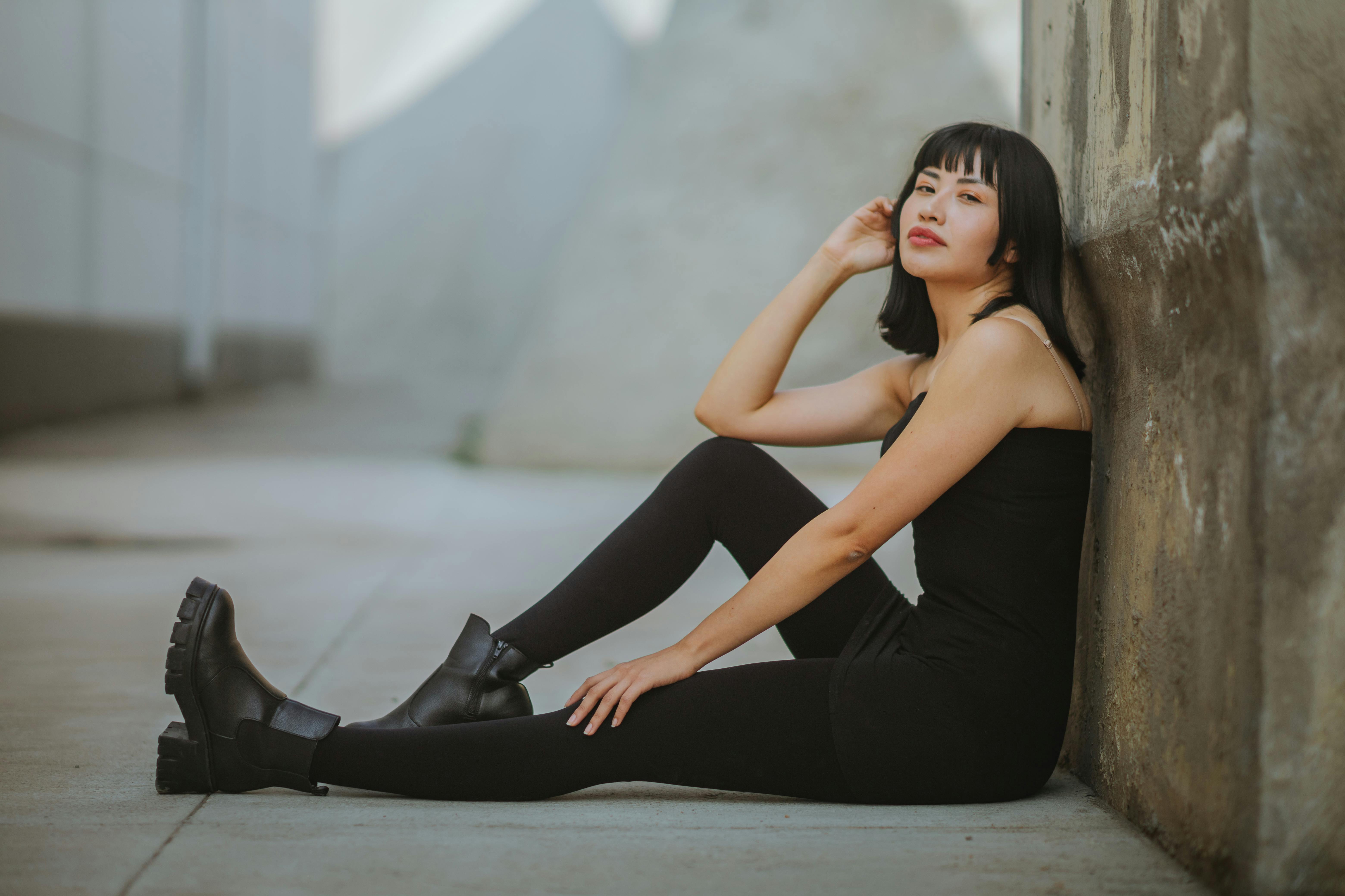 Blonde Fashion Model Crouching by Stairs in Office Building · Free ...