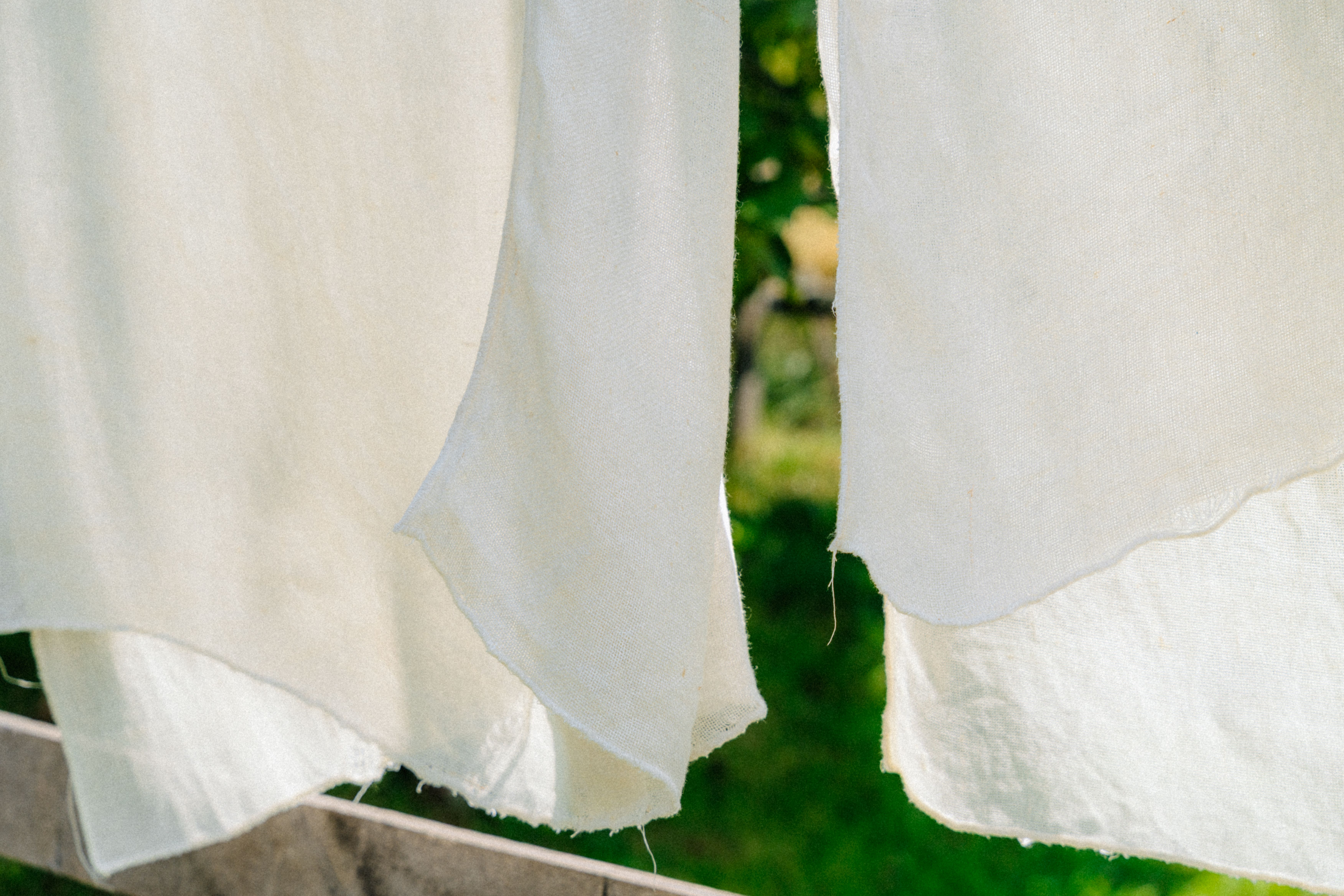 White Fabrics Drying Outdoors in Sunlight · Free Stock Photo