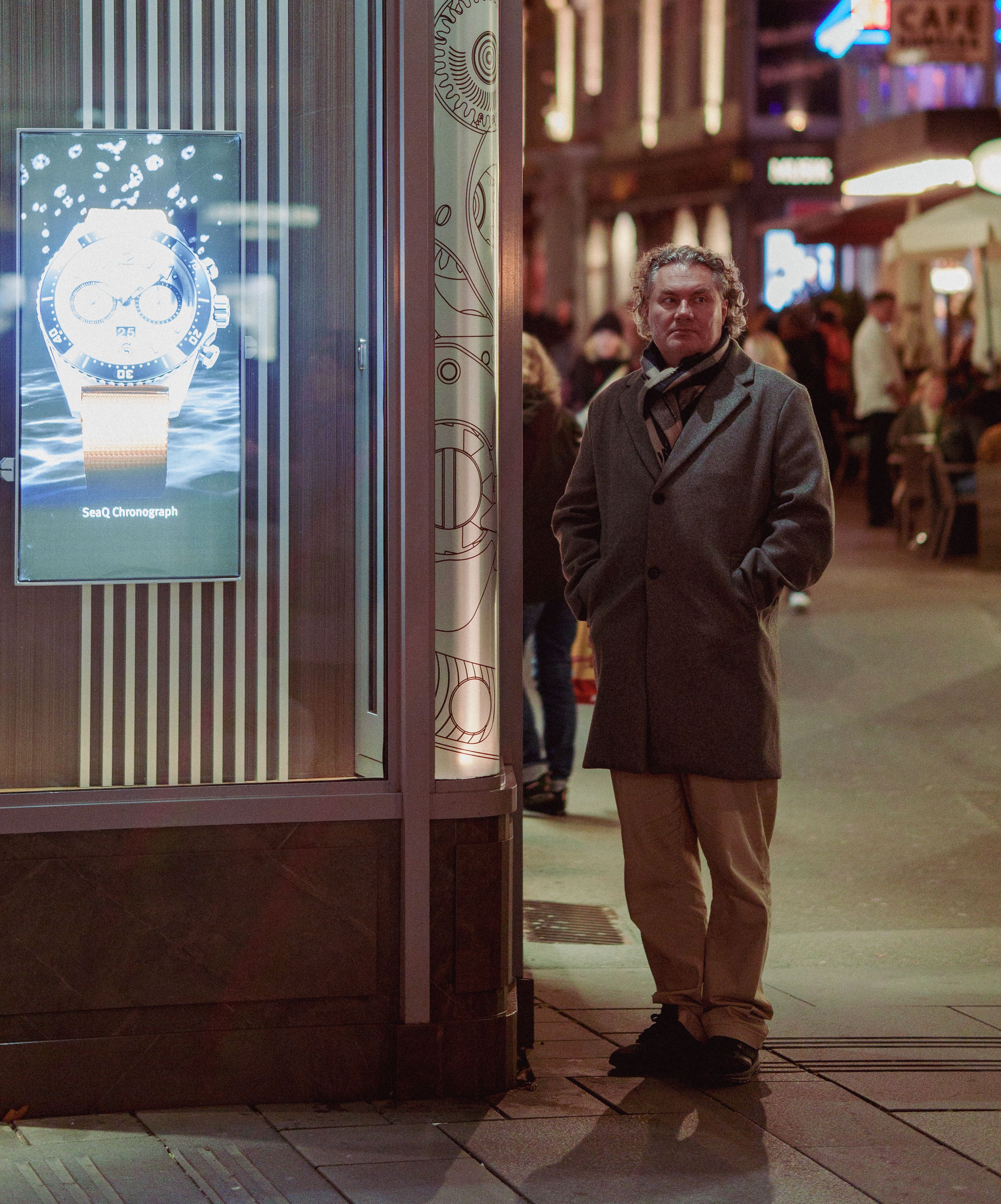 Man in Urban Night Street with Storefront View · Free Stock Photo