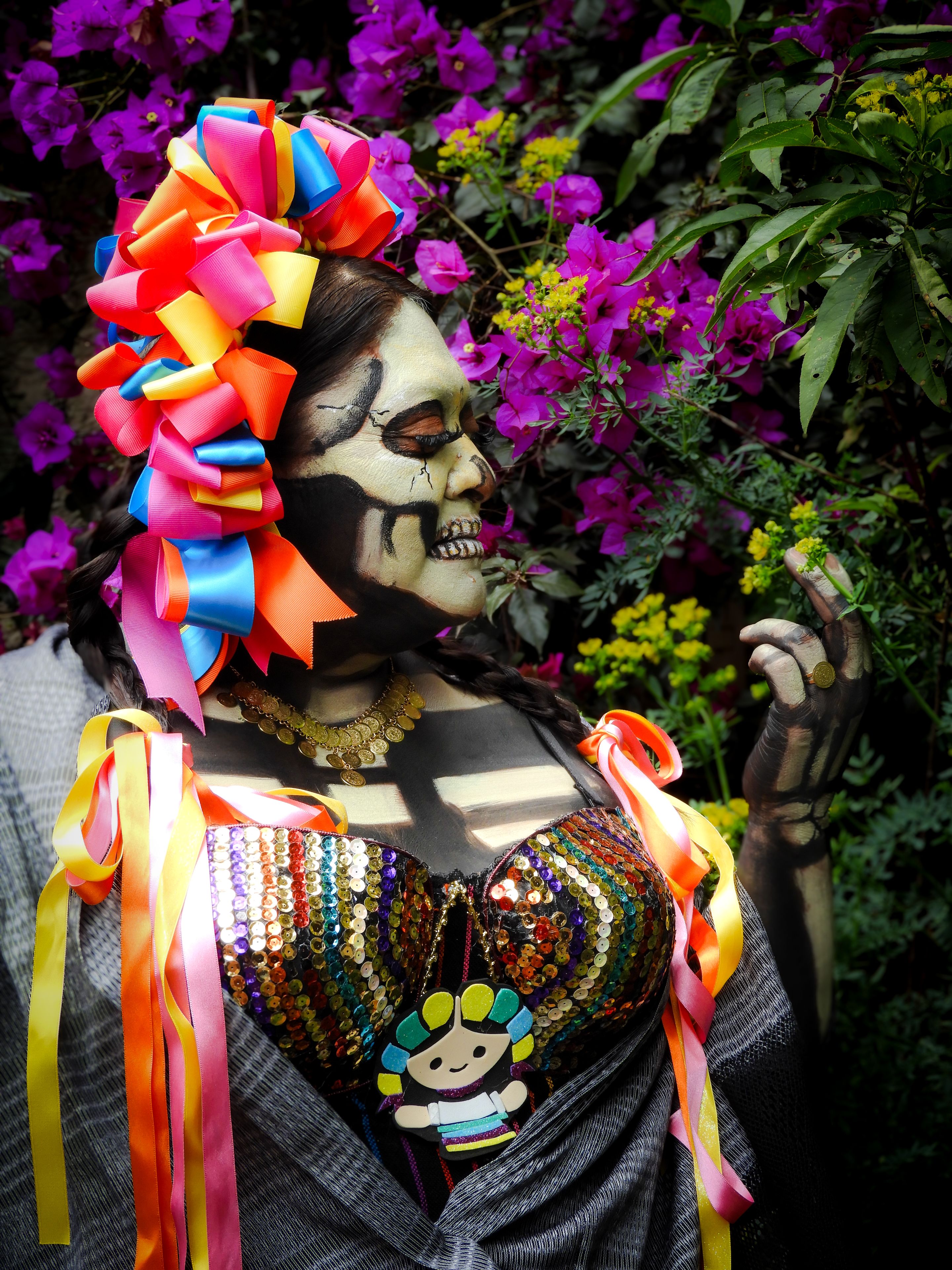 Colorful Catrina Costume in Outdoor Floral Setting · Free Stock Photo