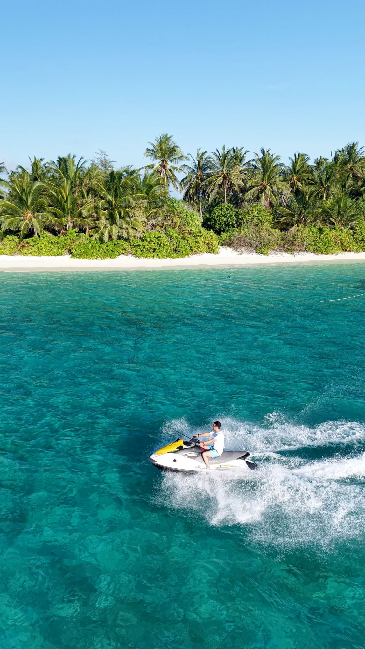 Empty Yellow and Black Jet Ski in Teal Sea Water · Free Stock Photo
