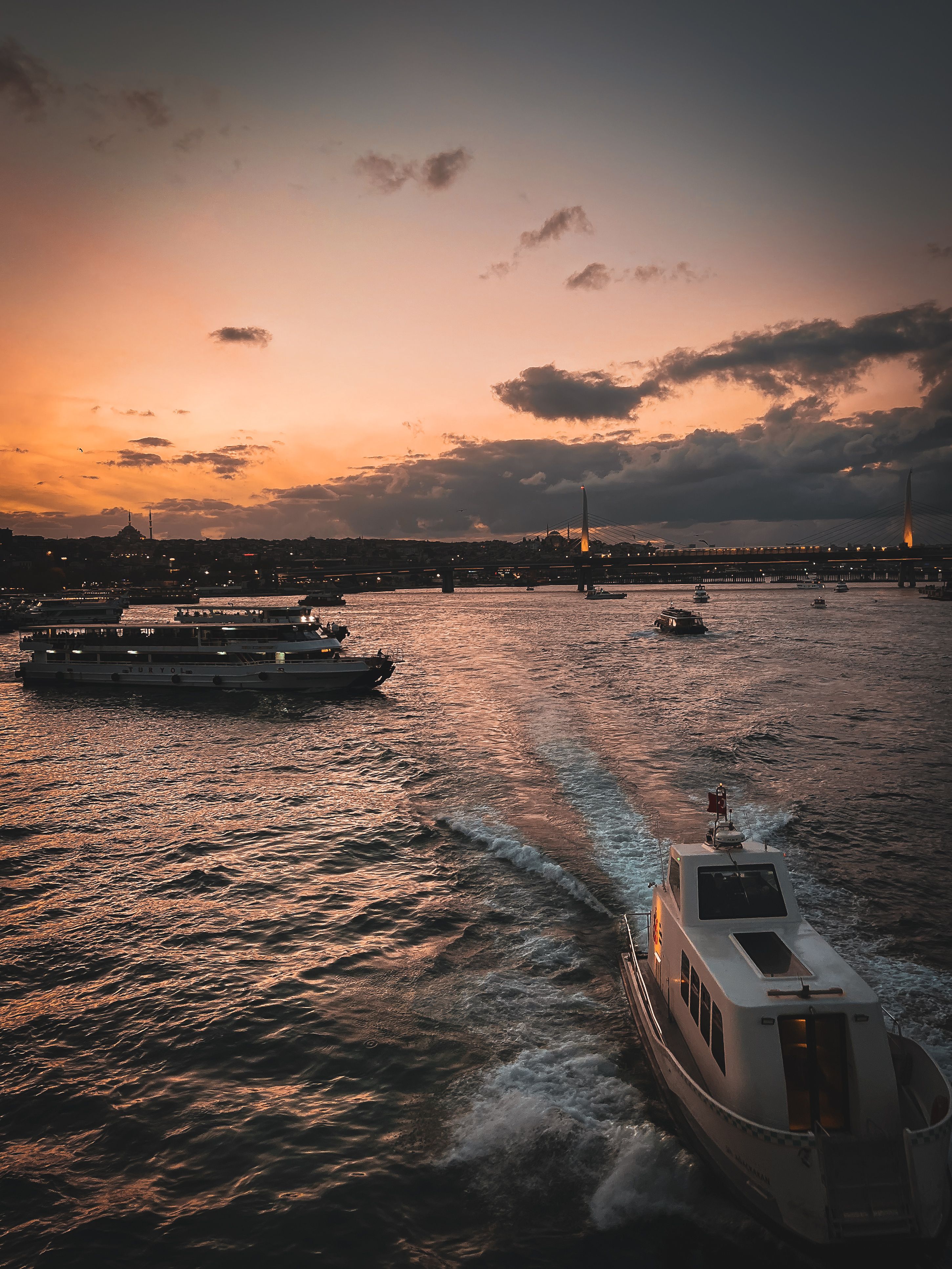 Scenic Sunset Over Water with Boats · Free Stock Photo