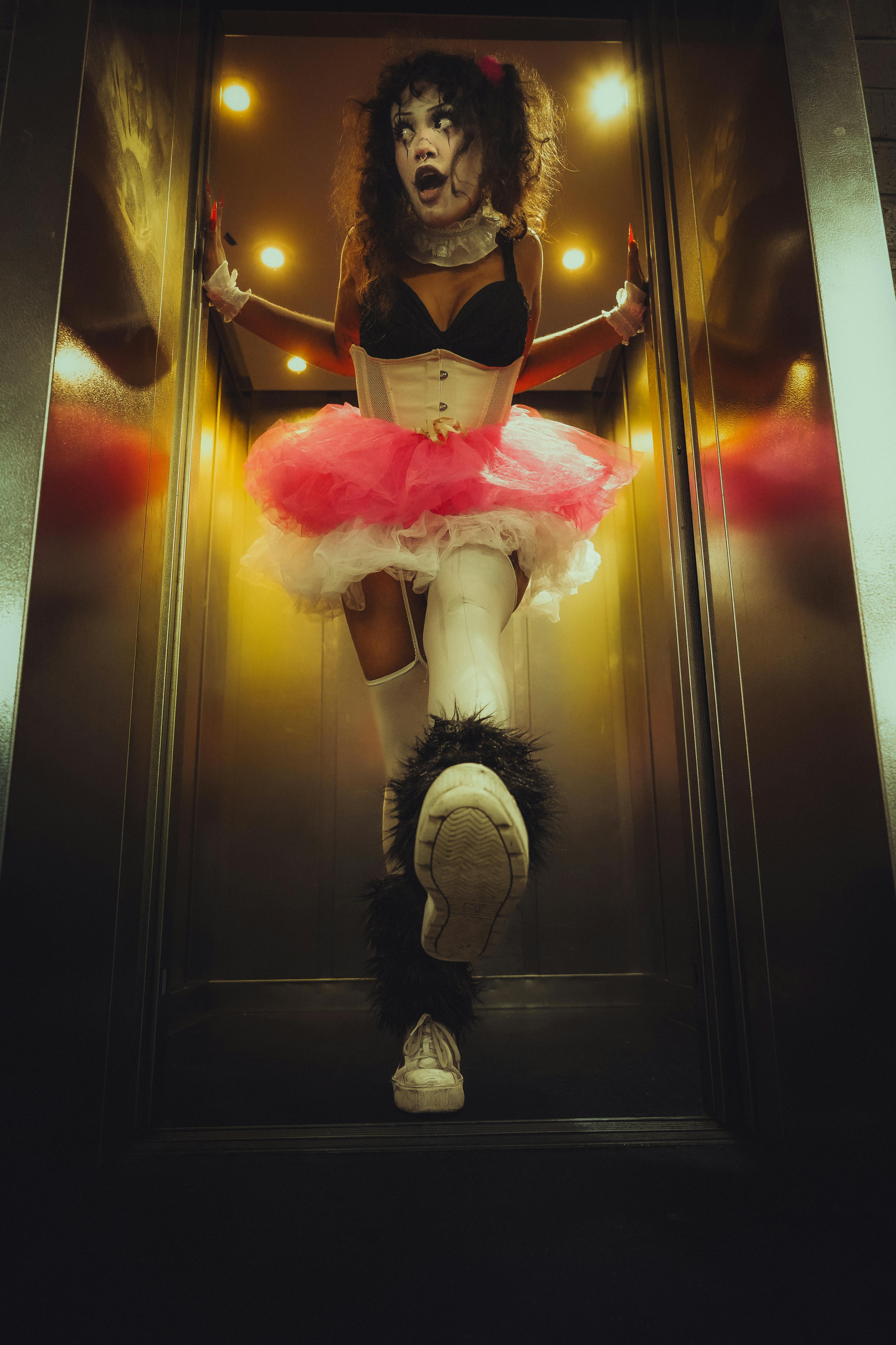 Dramatic Clown in Gothic Halloween Costume in Elevator · Free Stock Photo