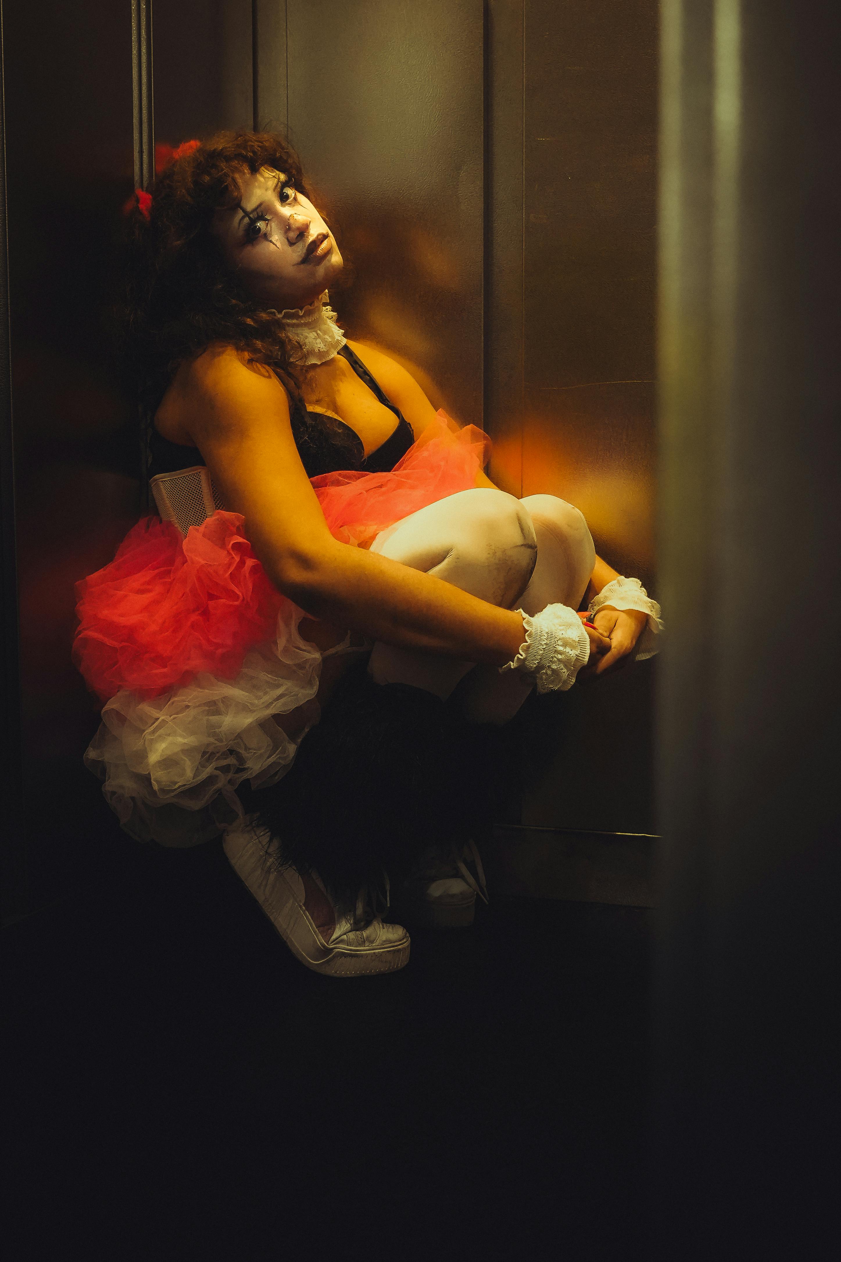 Creepy Clown in a Dimly Lit Elevator · Free Stock Photo
