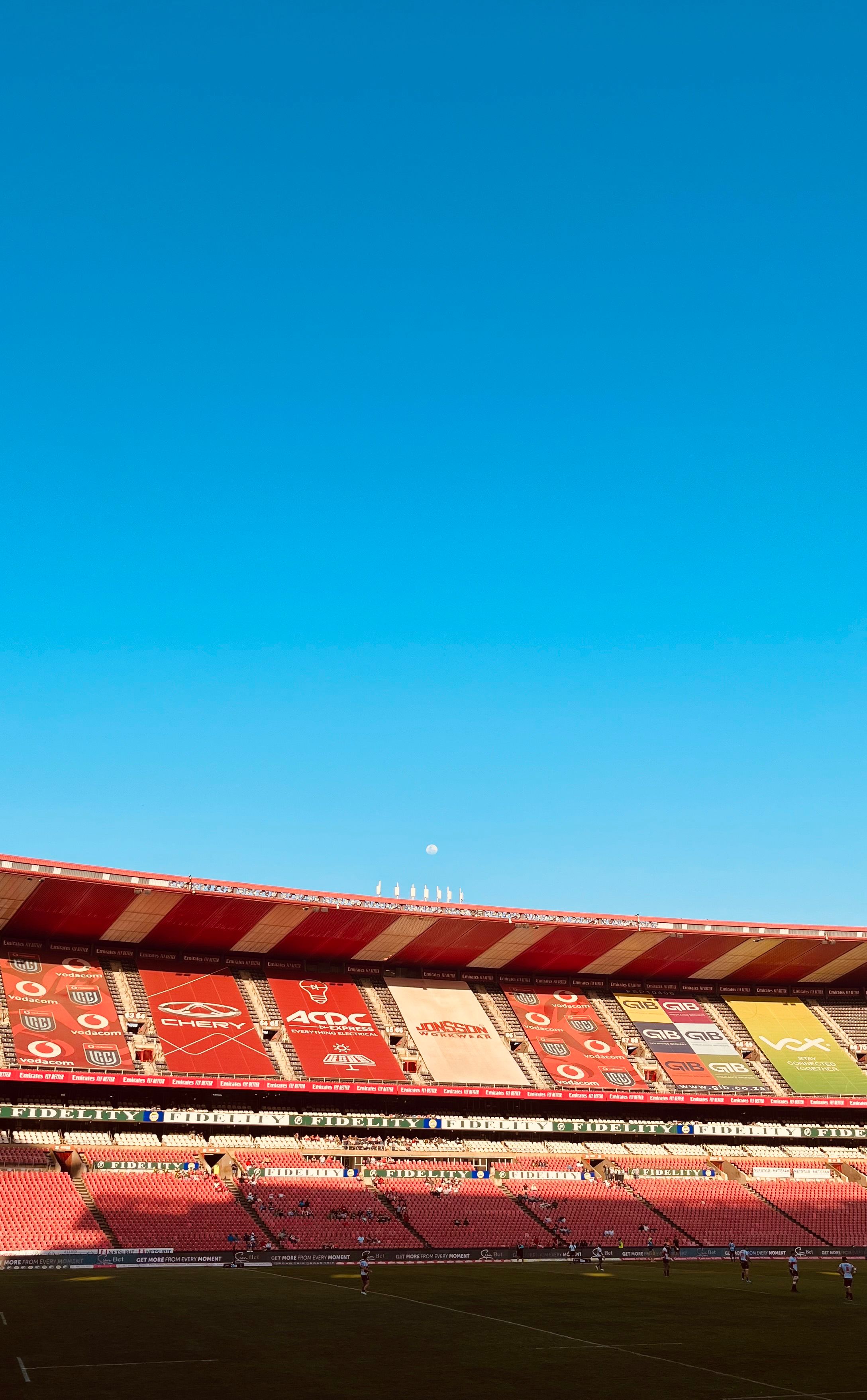 Green Grass Across Beige Red Open Sports Stadium during Daytime · Free ...