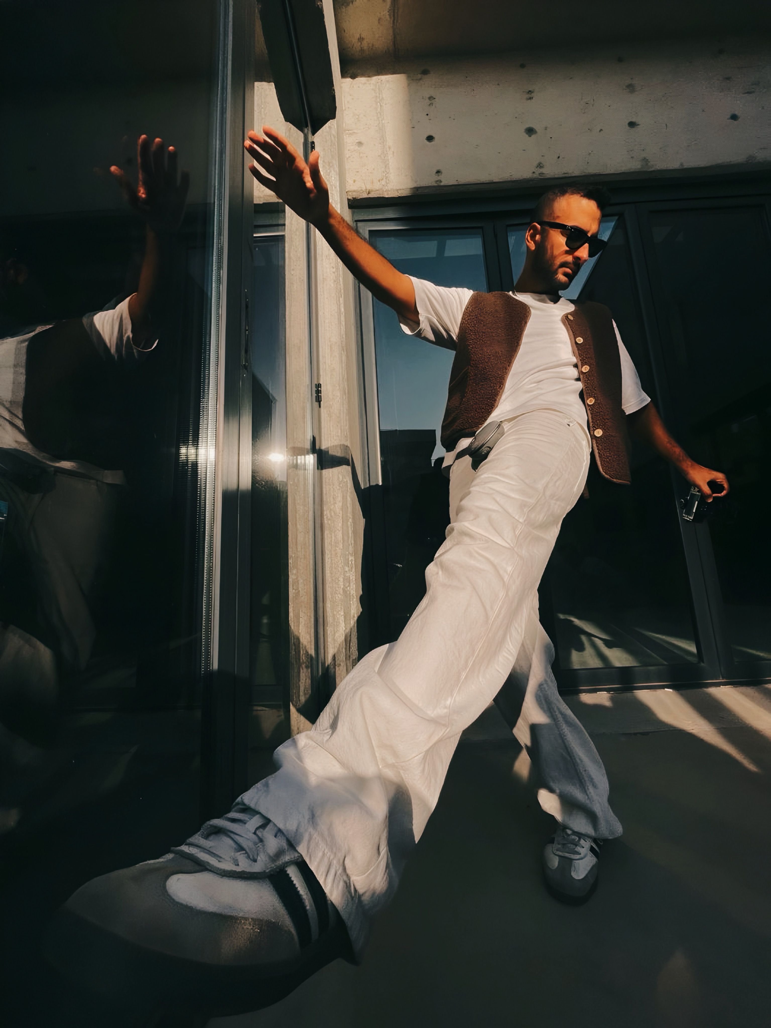 Stylish Man Posing with Reflection Outdoors · Free Stock Photo