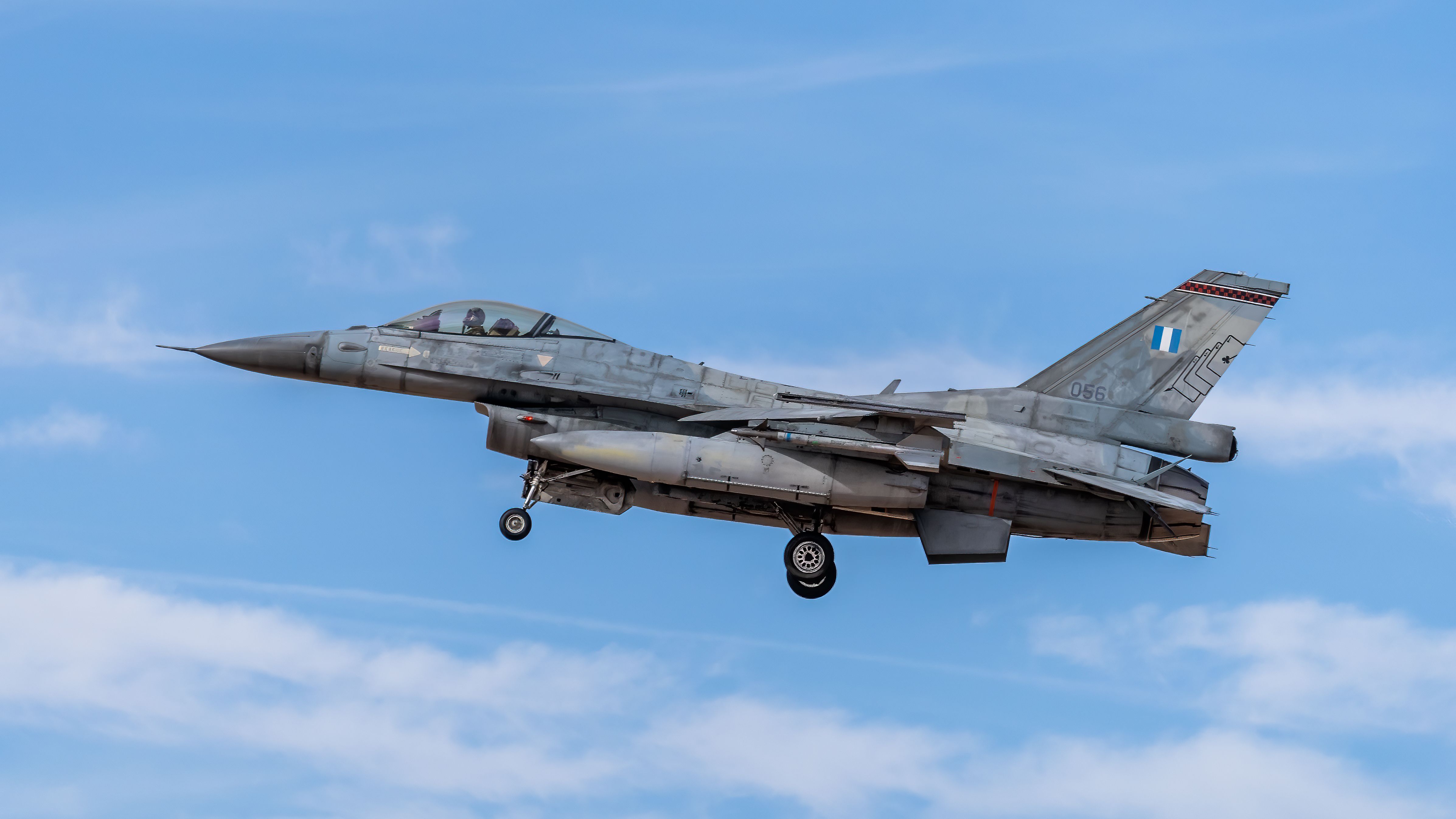 F-16 Fighter Jet in Flight Against Blue Sky · Free Stock Photo
