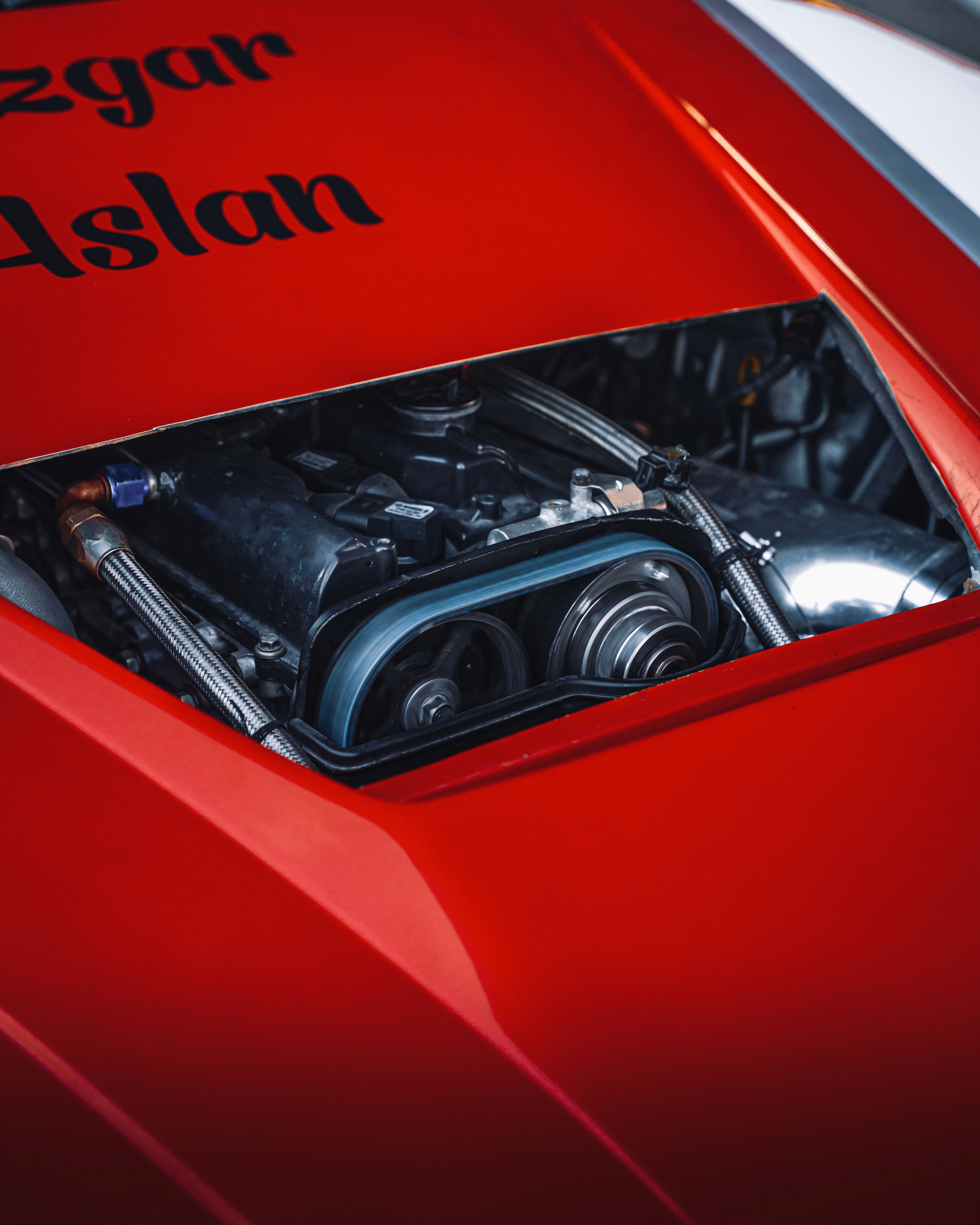 Red Sports Car Engine Compartment Close-Up · Free Stock Photo