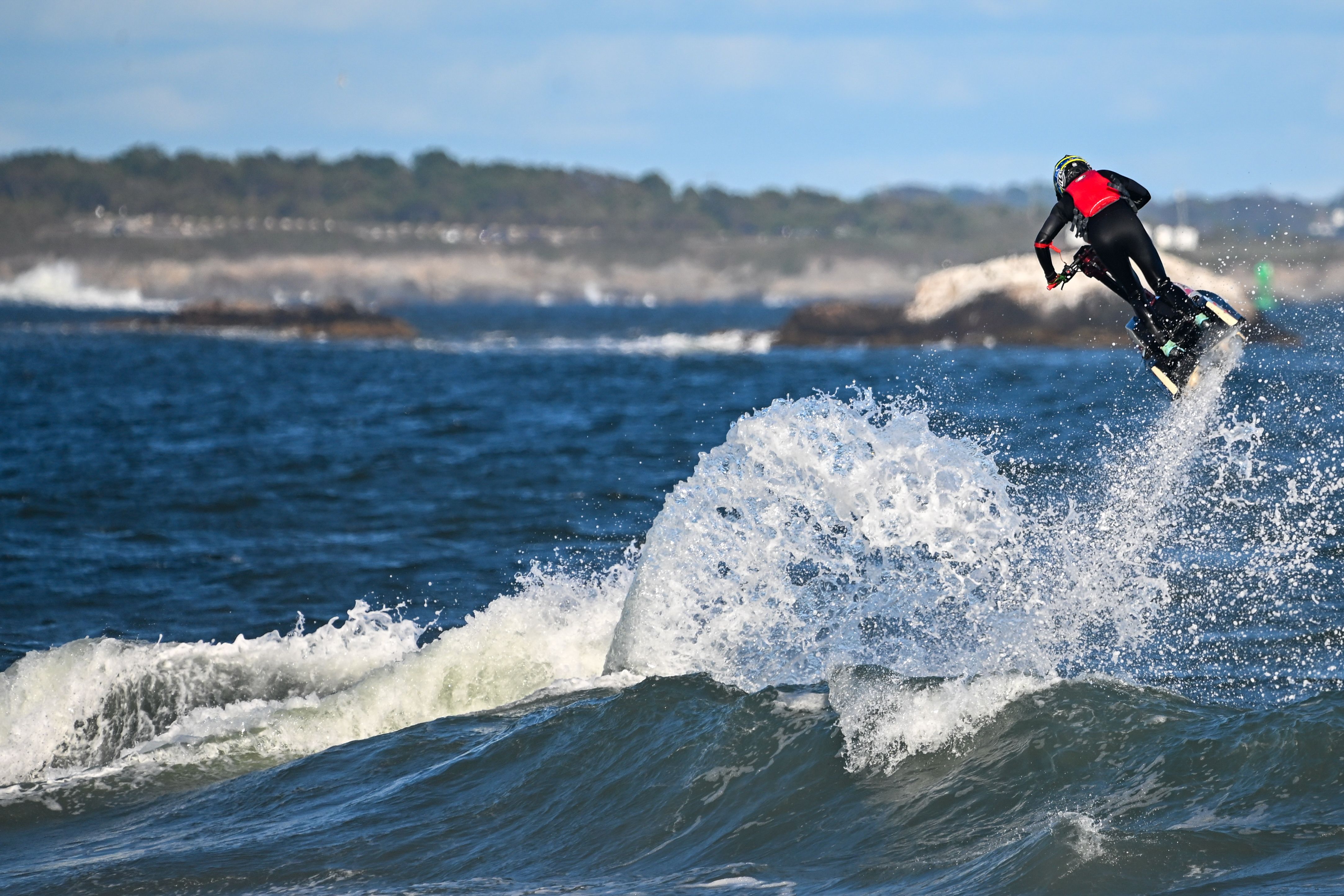 Jet Skier Performing Stunt on Ocean Waves · Free Stock Photo